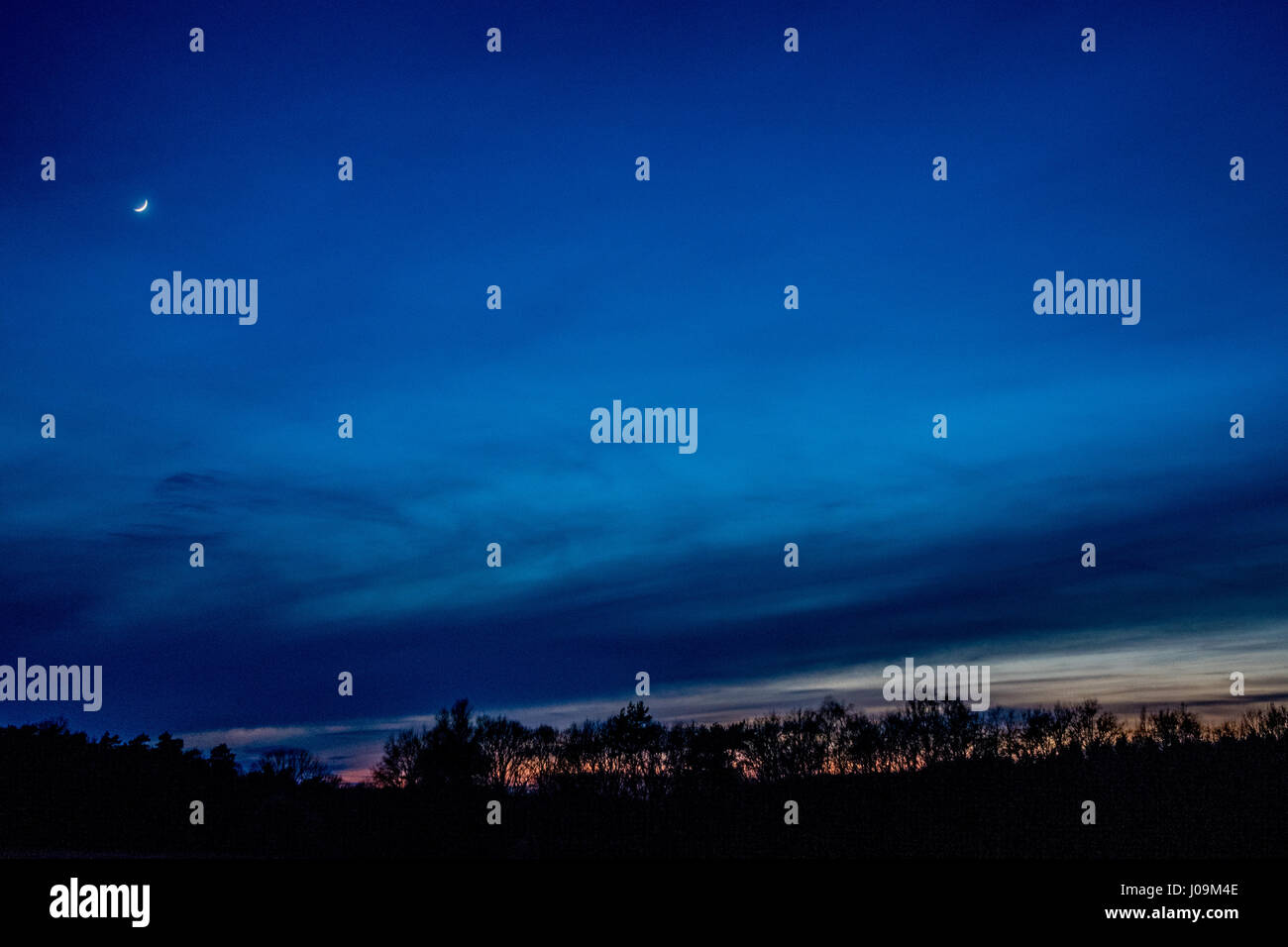 blue sky with moon and open road background Stock Photo - Alamy