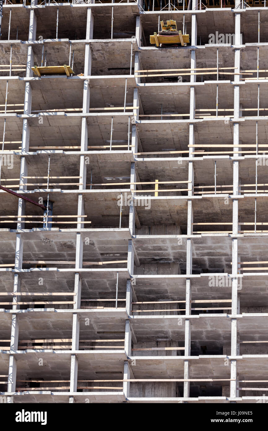high-rise construction site with concrete structure in process of being ...