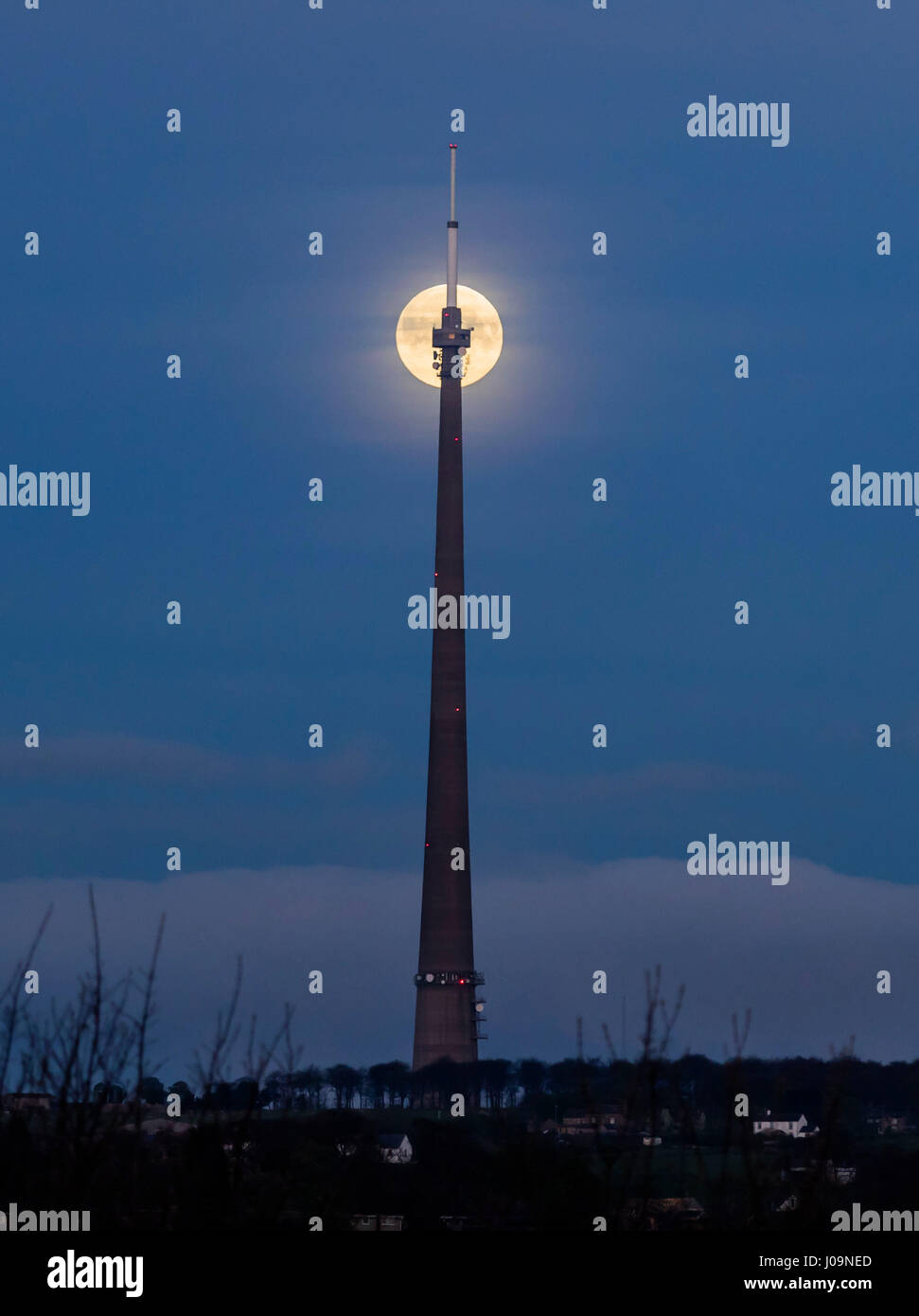 April's full moon, also known as a 'Pink Moon', is seen near Emley Moor ...