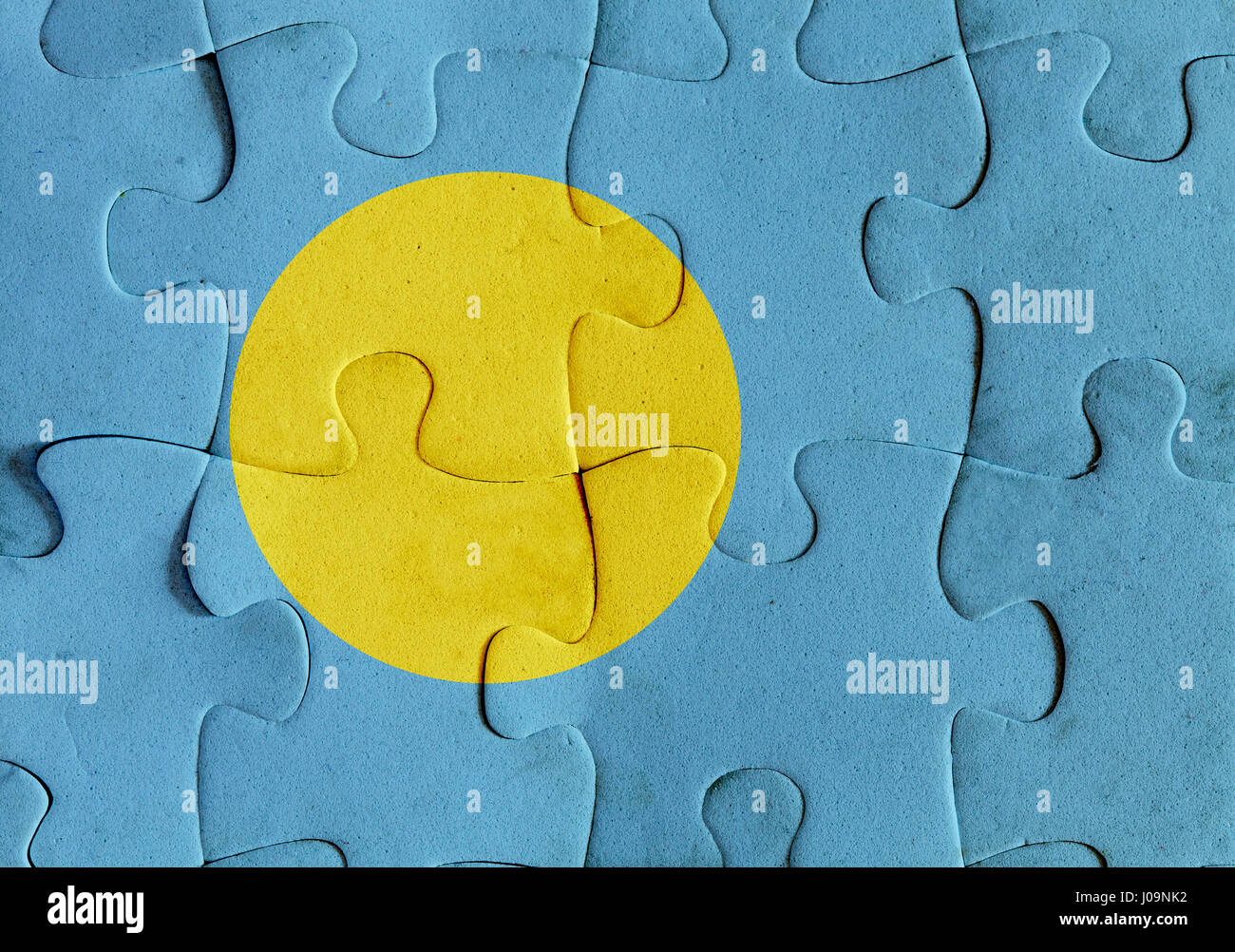 Illustration of a flag of Republic of Palau over some puzzle pieces ...