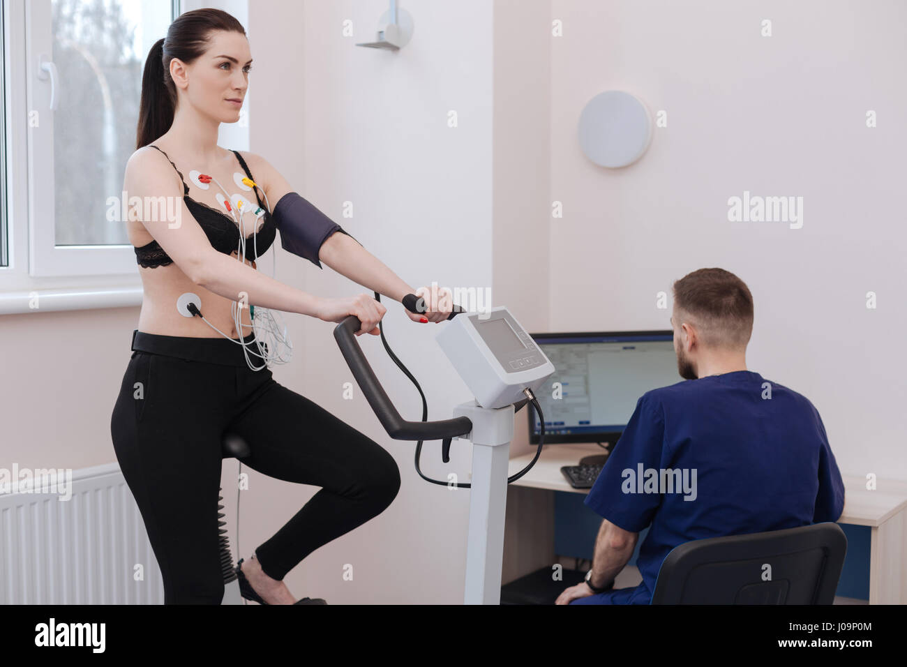 Charismatic enchanting woman doing some exercises Stock Photo - Alamy