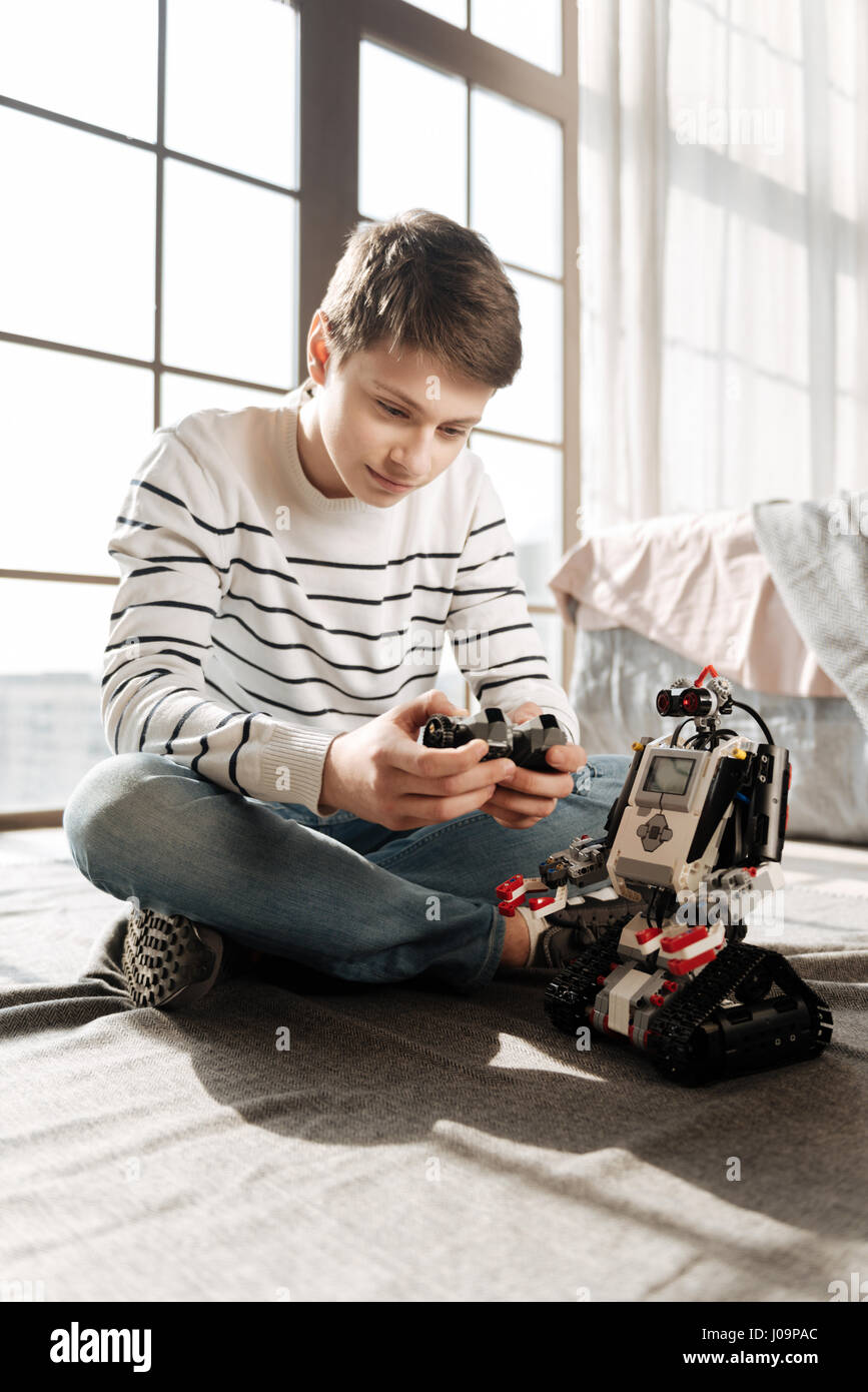 Best toy ever. Attractive young male person keeping smile on face ...