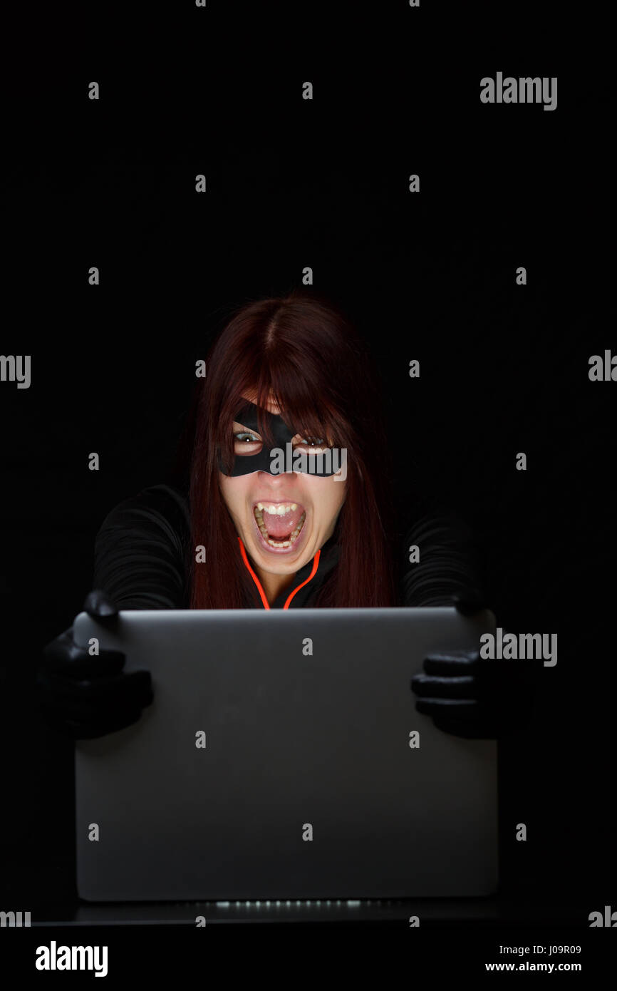Screaming female hacker at night Stock Photo - Alamy