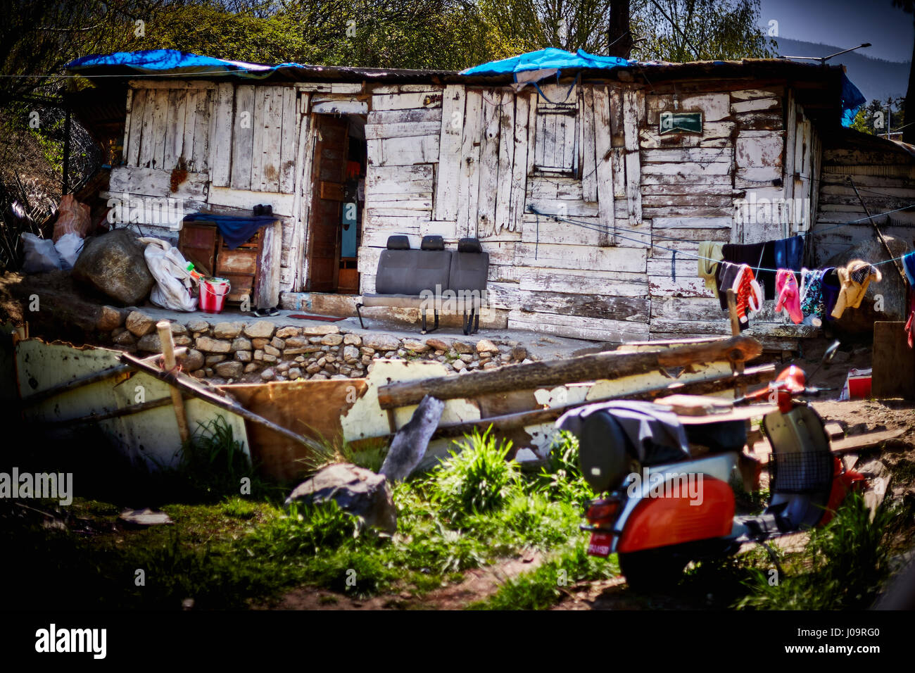 White shack with red scooter in front in Thimphu Bhutan Stock Photo - Alamy