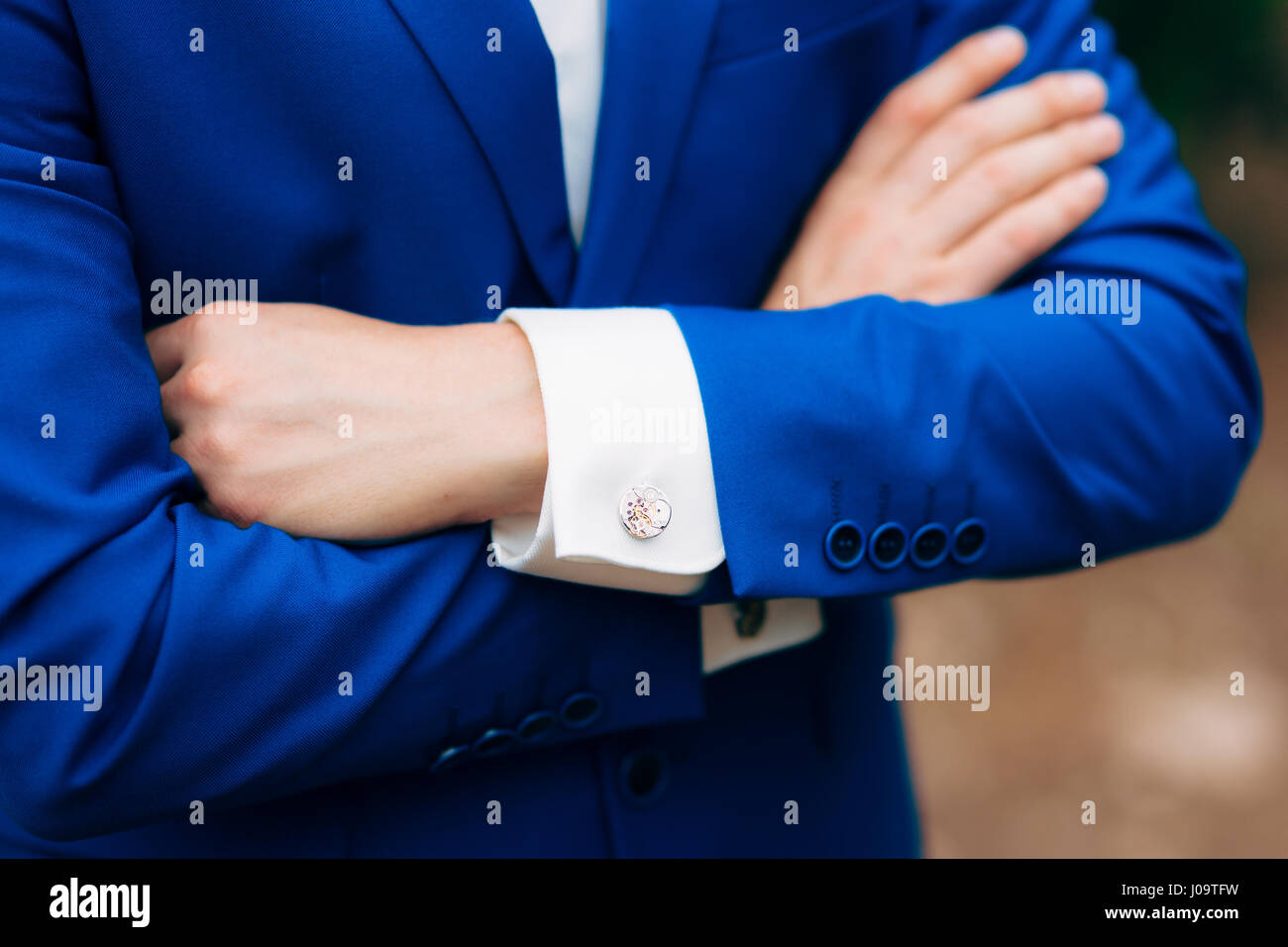 Male hands crossed on chest Stock Photo - Alamy