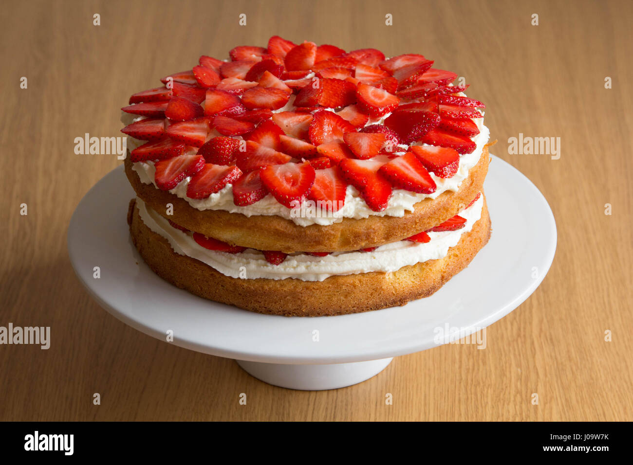 Victoria Sponge Cake with Whipped Cream and Strawberry Stock Photo - Alamy