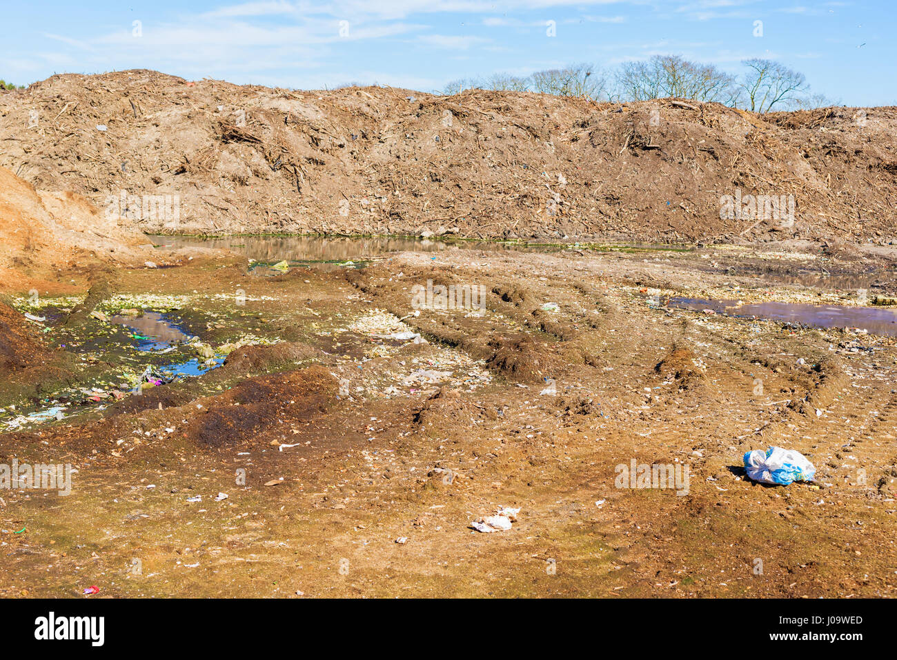 Piles of soil deposits at landfill over old dump Stock Photo - Alamy