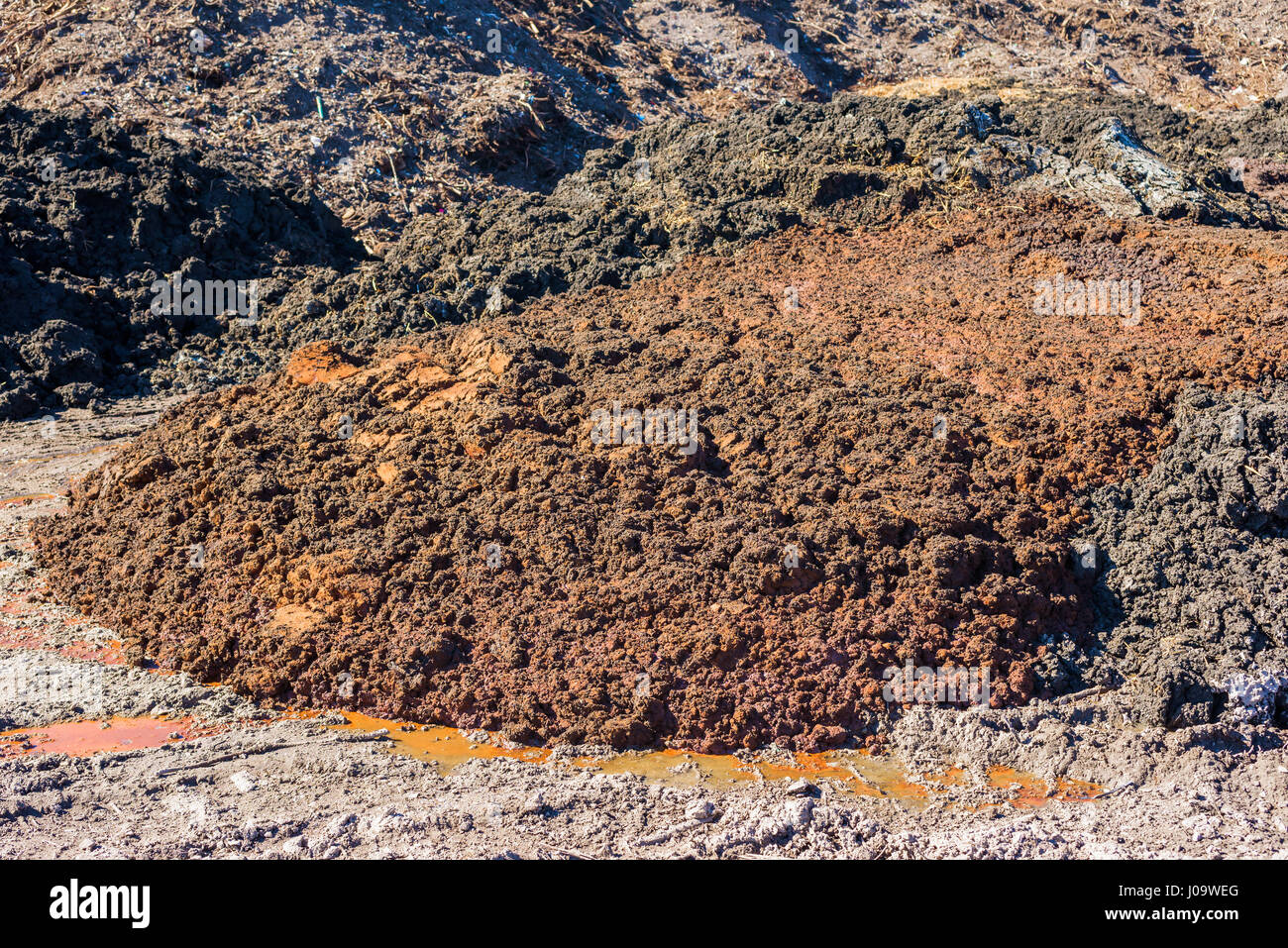 Piles of soil deposits at landfill over old dump Stock Photo - Alamy