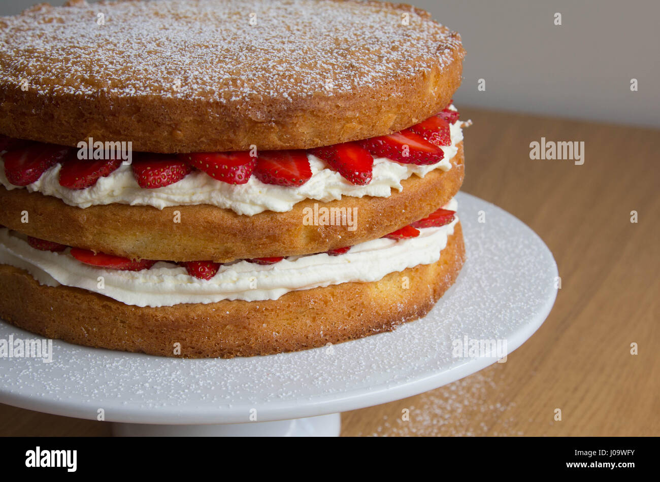 Victoria Sponge Cake with Whipped Cream and Strawberry Stock Photo - Alamy