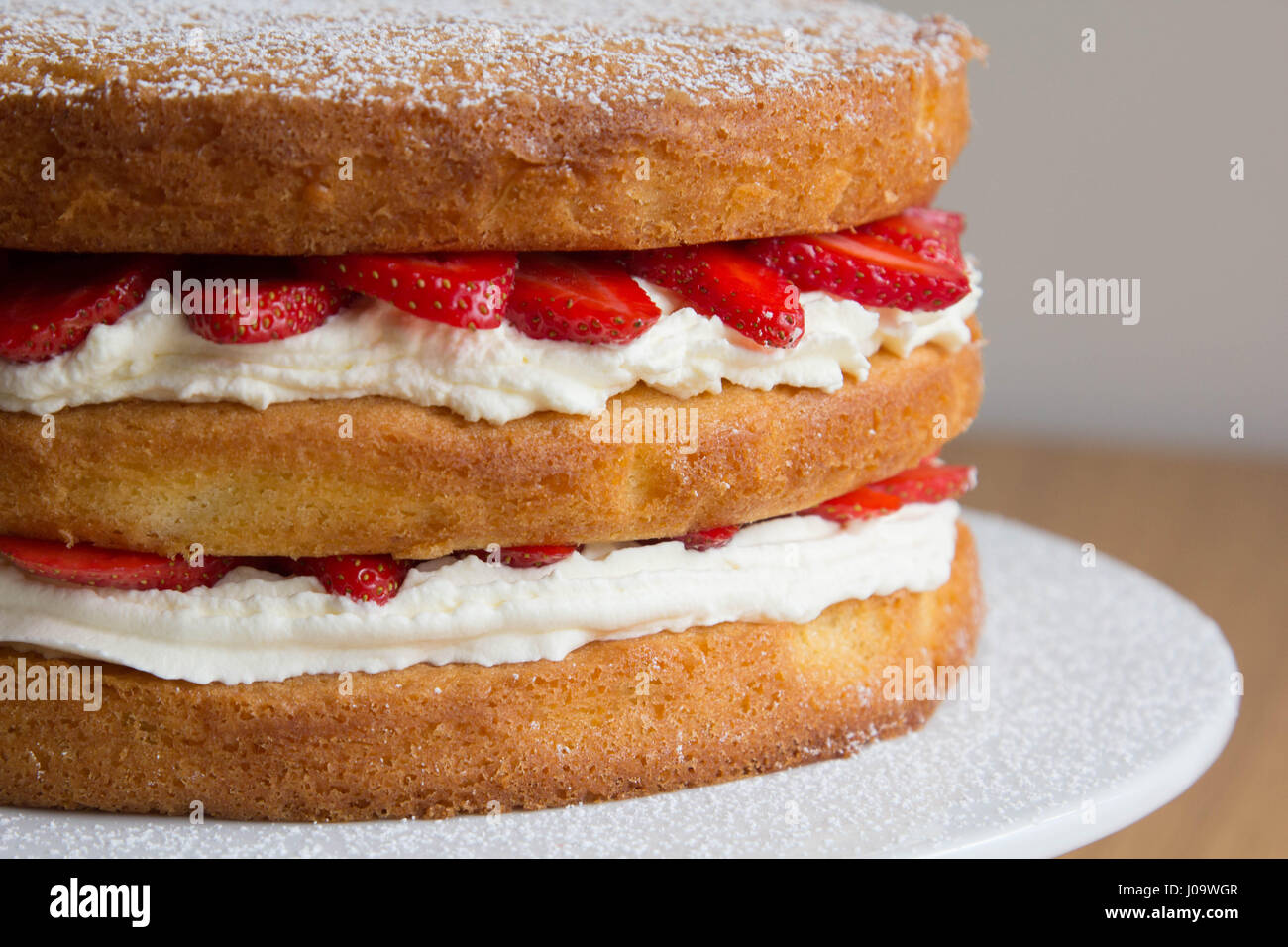 Victoria Sponge Cake with Whipped Cream and Strawberry Stock Photo - Alamy
