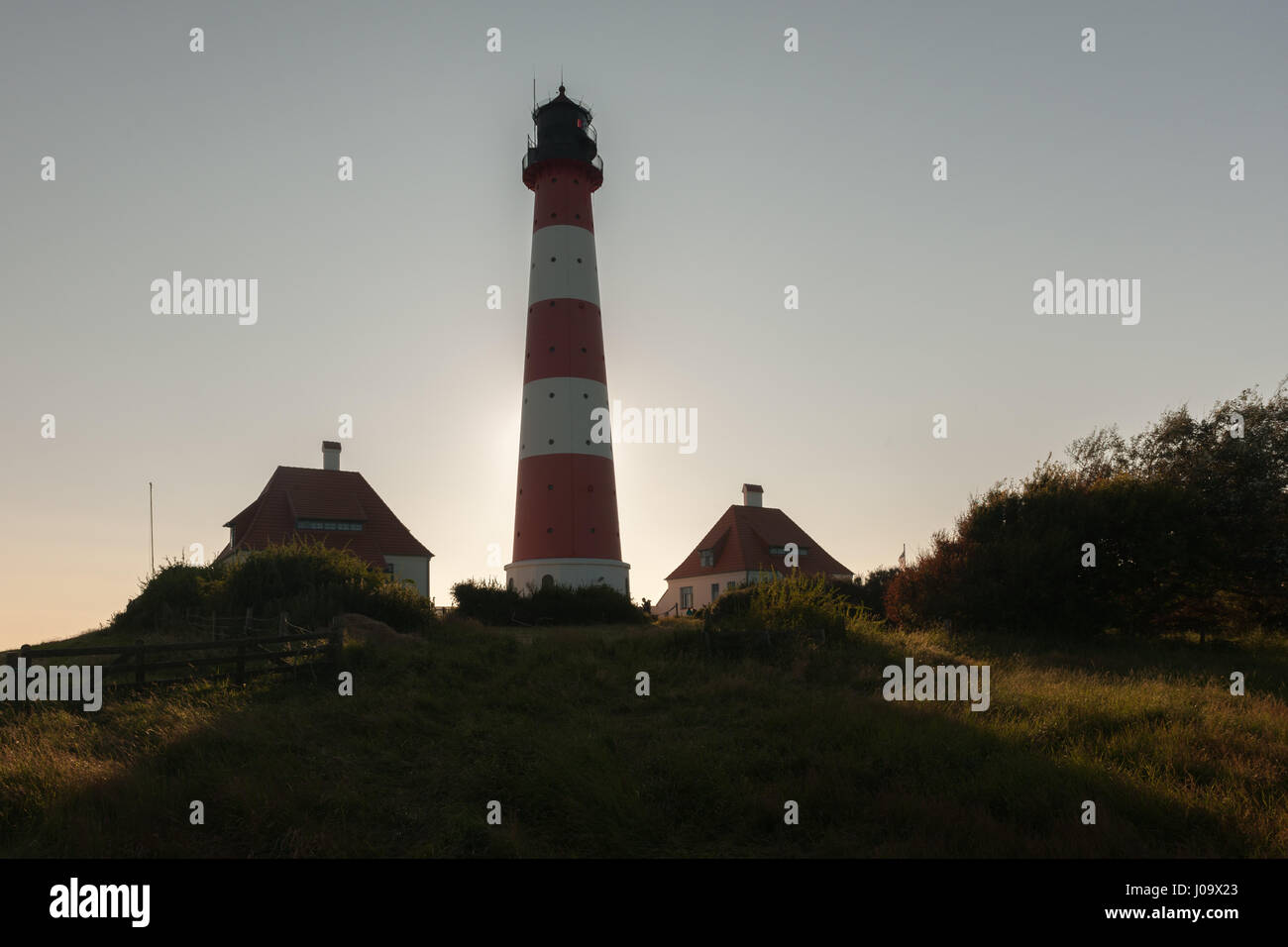 Germany´s most famous lighthouse Westerheversand in the salt marshes ...