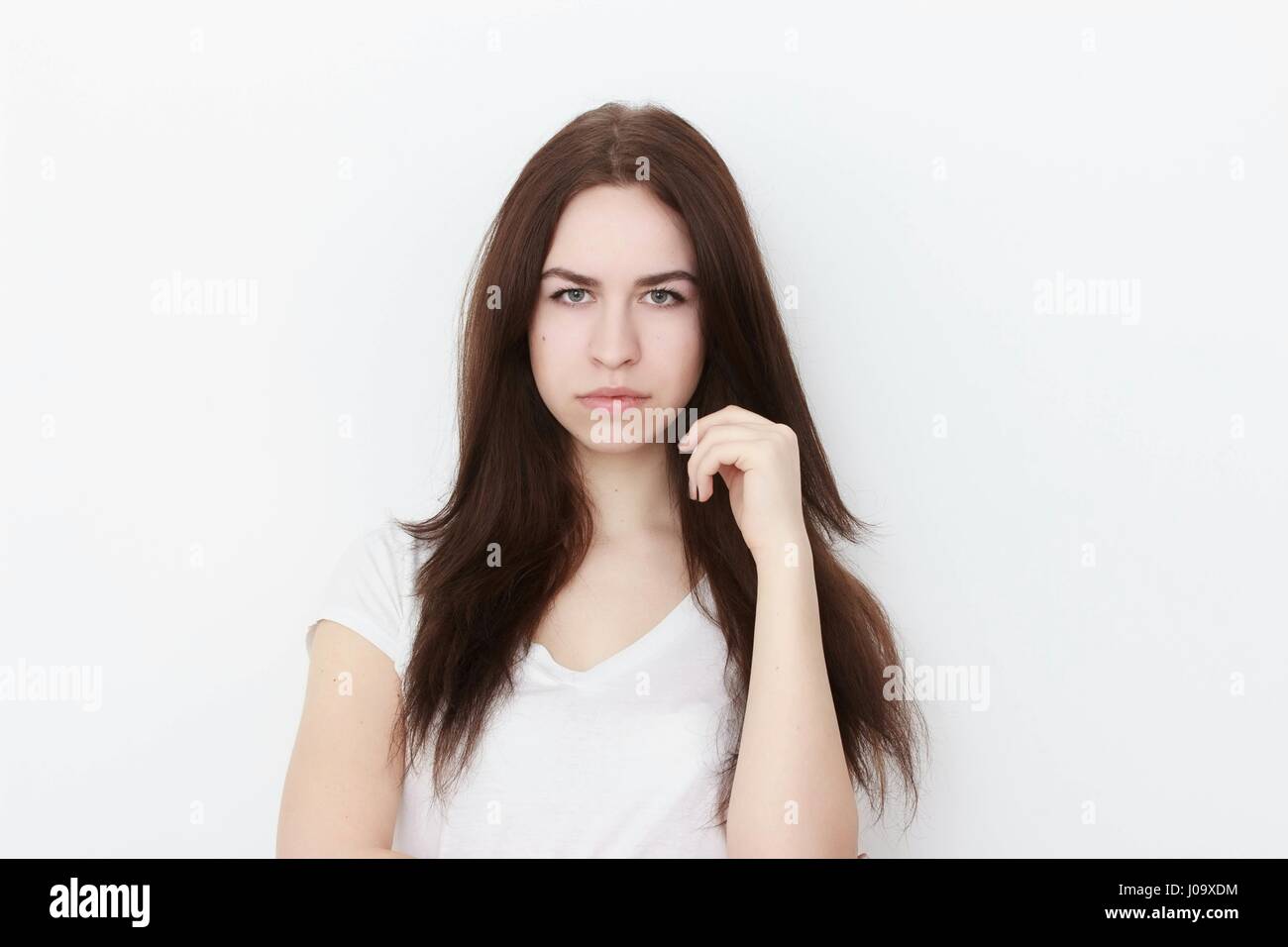 Young casual woman In pink blouse isolated over white background studio ...
