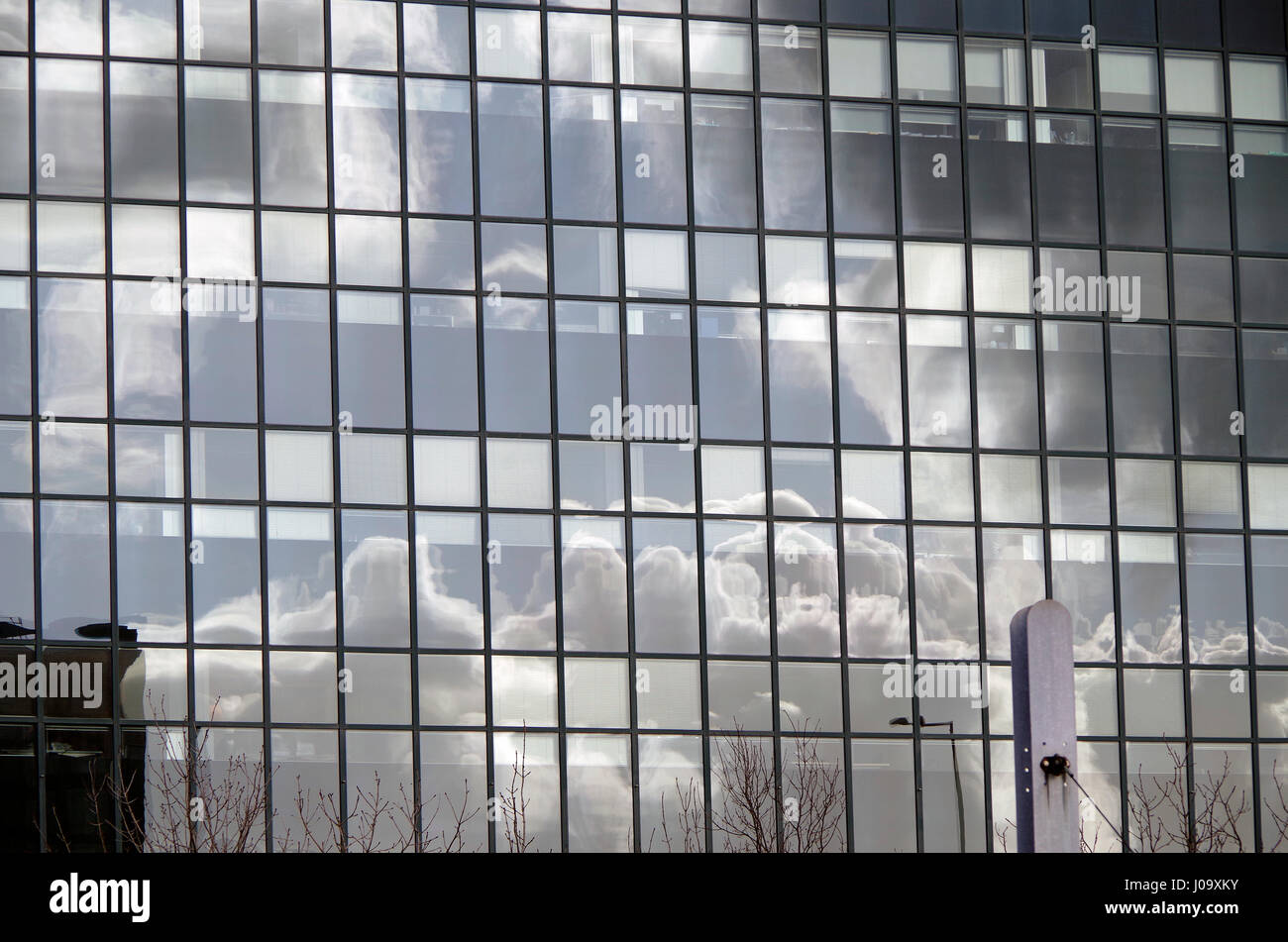 clouds and sunshine reflected in curtain walling,office buildings ...