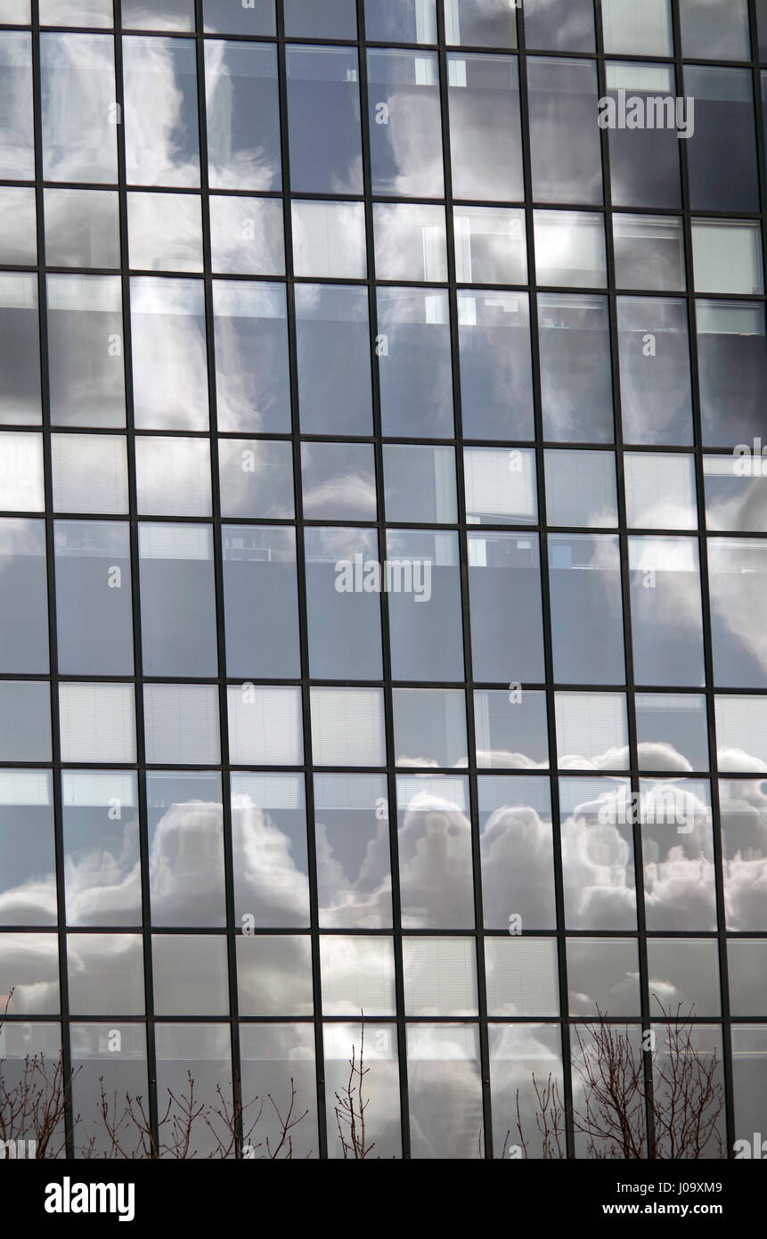 clouds and sunshine reflected in curtain walling,office buildings ...