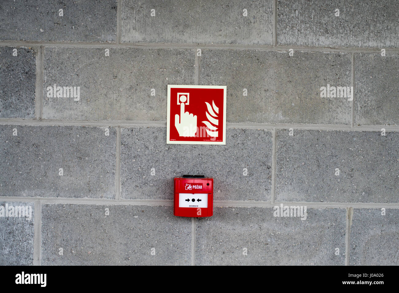Emergency Fire Exit on the stone wall Stock Photo - Alamy