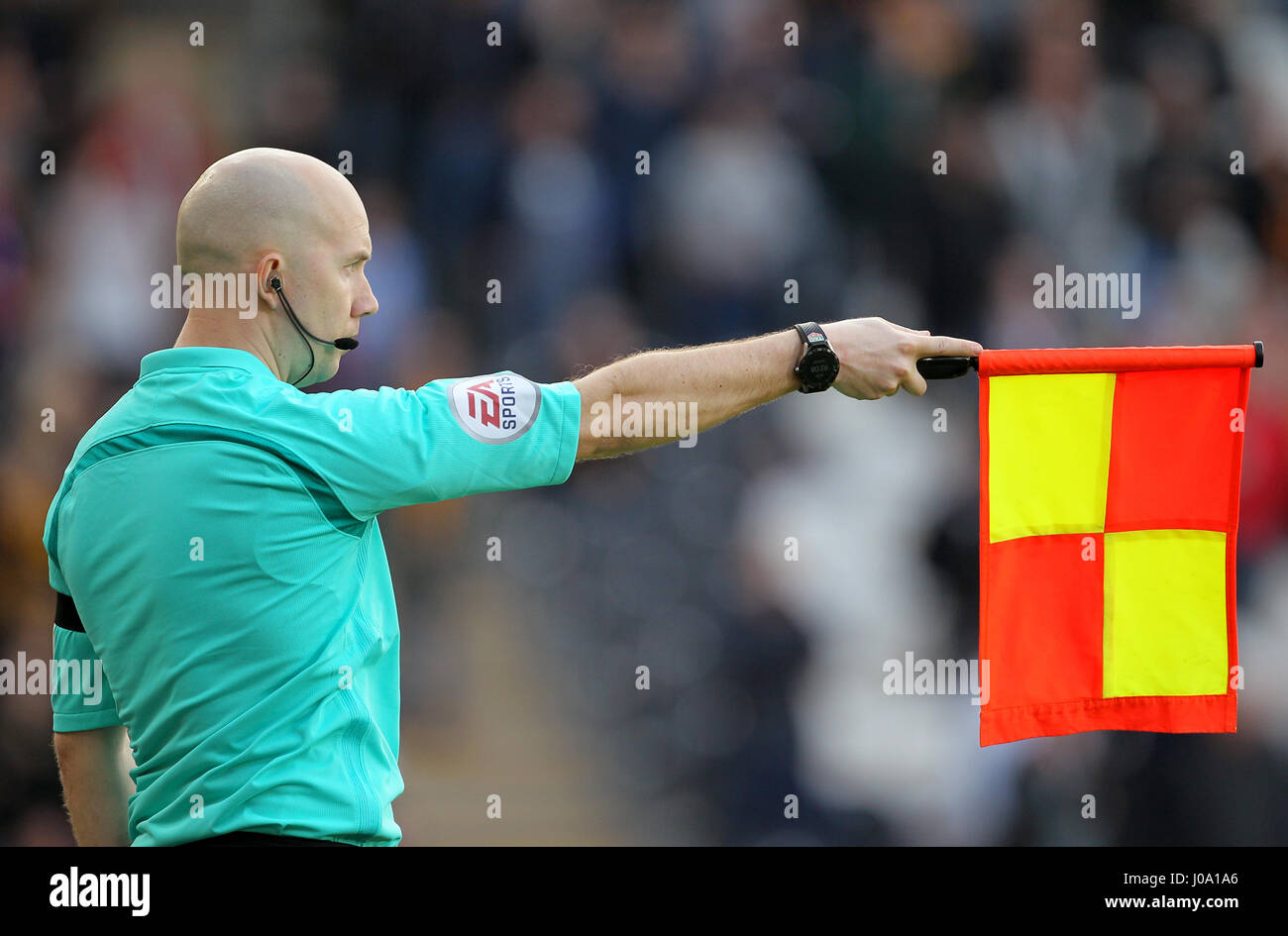 Assistant referee Matt Wilkes raises his flag for offside Stock Photo ...