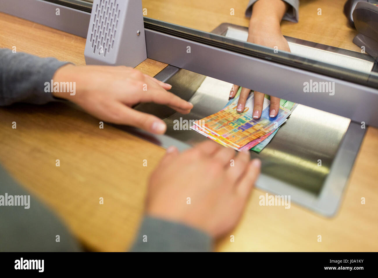 clerk giving cash money to customer at bank office Stock Photo - Alamy