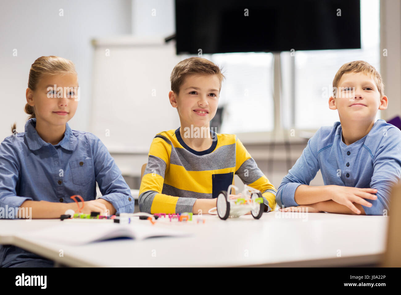 happy children building robots at robotics school Stock Photo - Alamy
