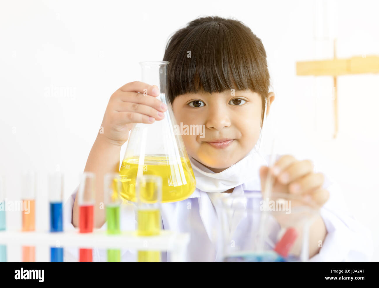 Asian child playing scientist with colorful lab tubes Stock Photo - Alamy