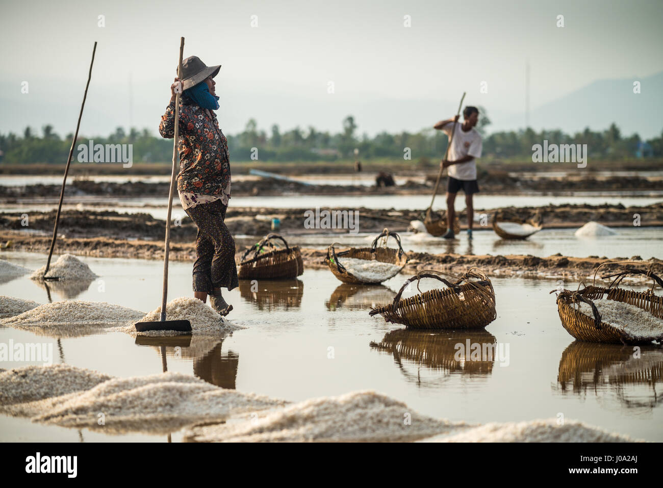Local people working in the salt fields of Kampot, Cambodia, Asia Stock ...