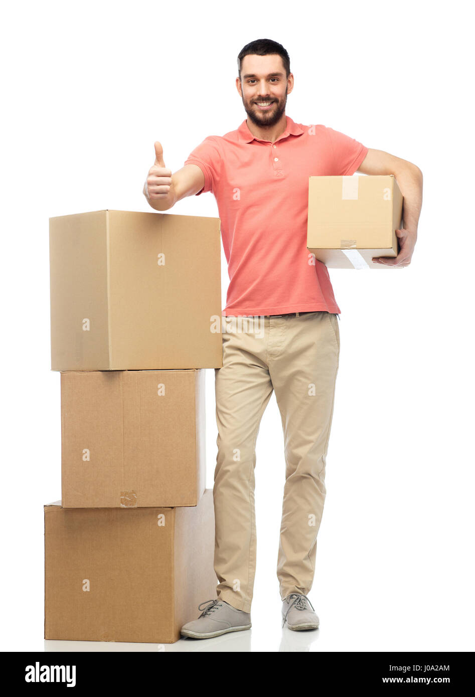 happy man with cardboard boxes showing thumbs up Stock Photo - Alamy
