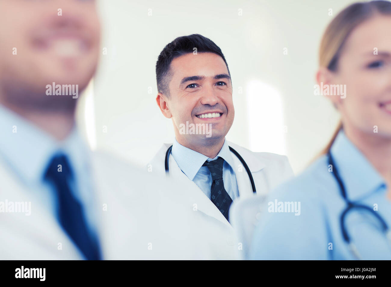 happy doctor over group of medics at hospital Stock Photo - Alamy