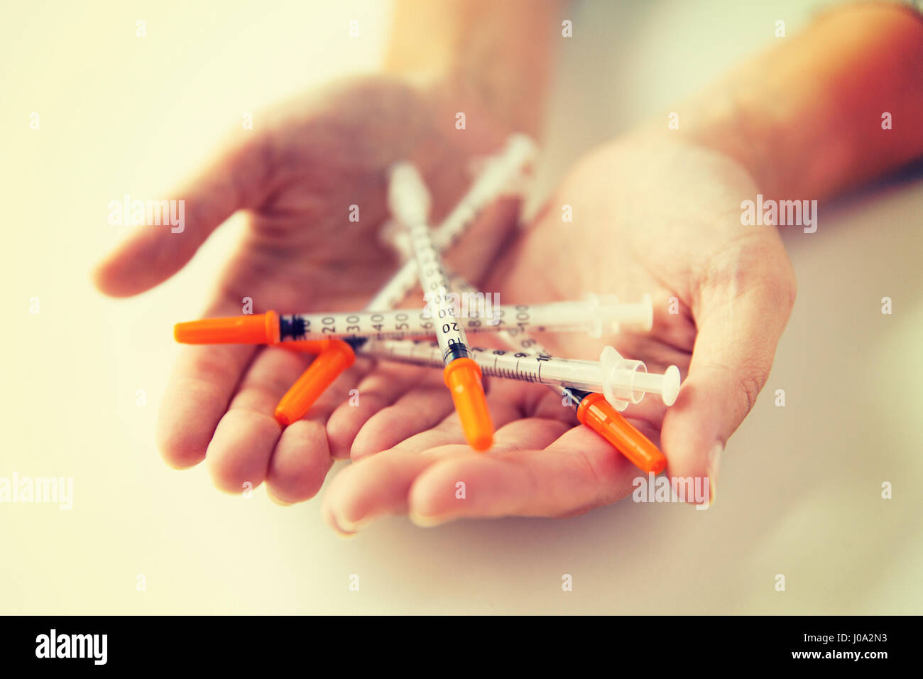 close up of woman hands holding insulin syringes Stock Photo - Alamy