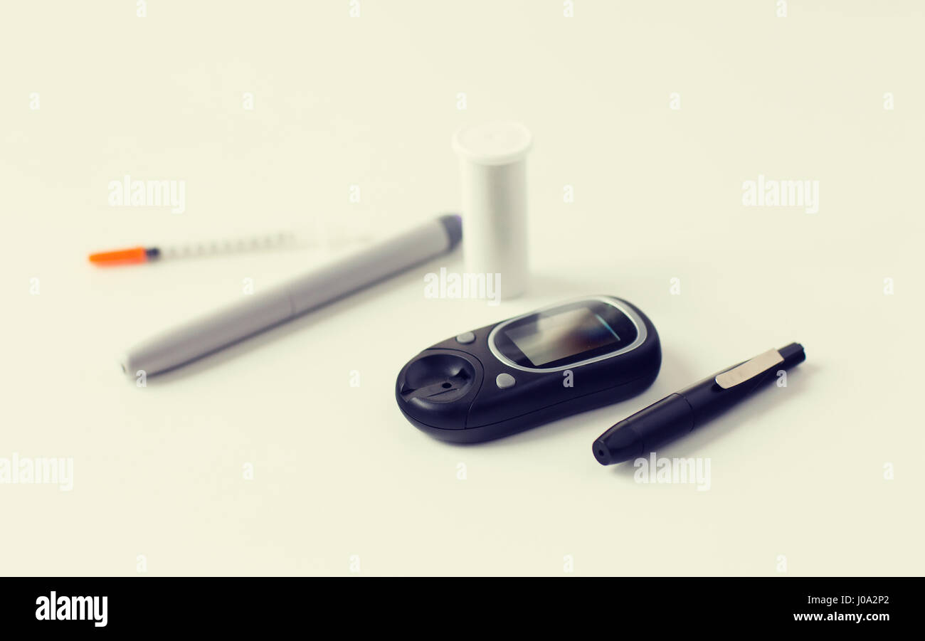 close up of glucometer, insulin pen and syringe Stock Photo - Alamy