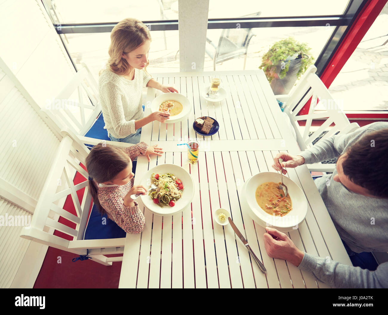 happy family having dinner at restaurant or cafe Stock Photo - Alamy