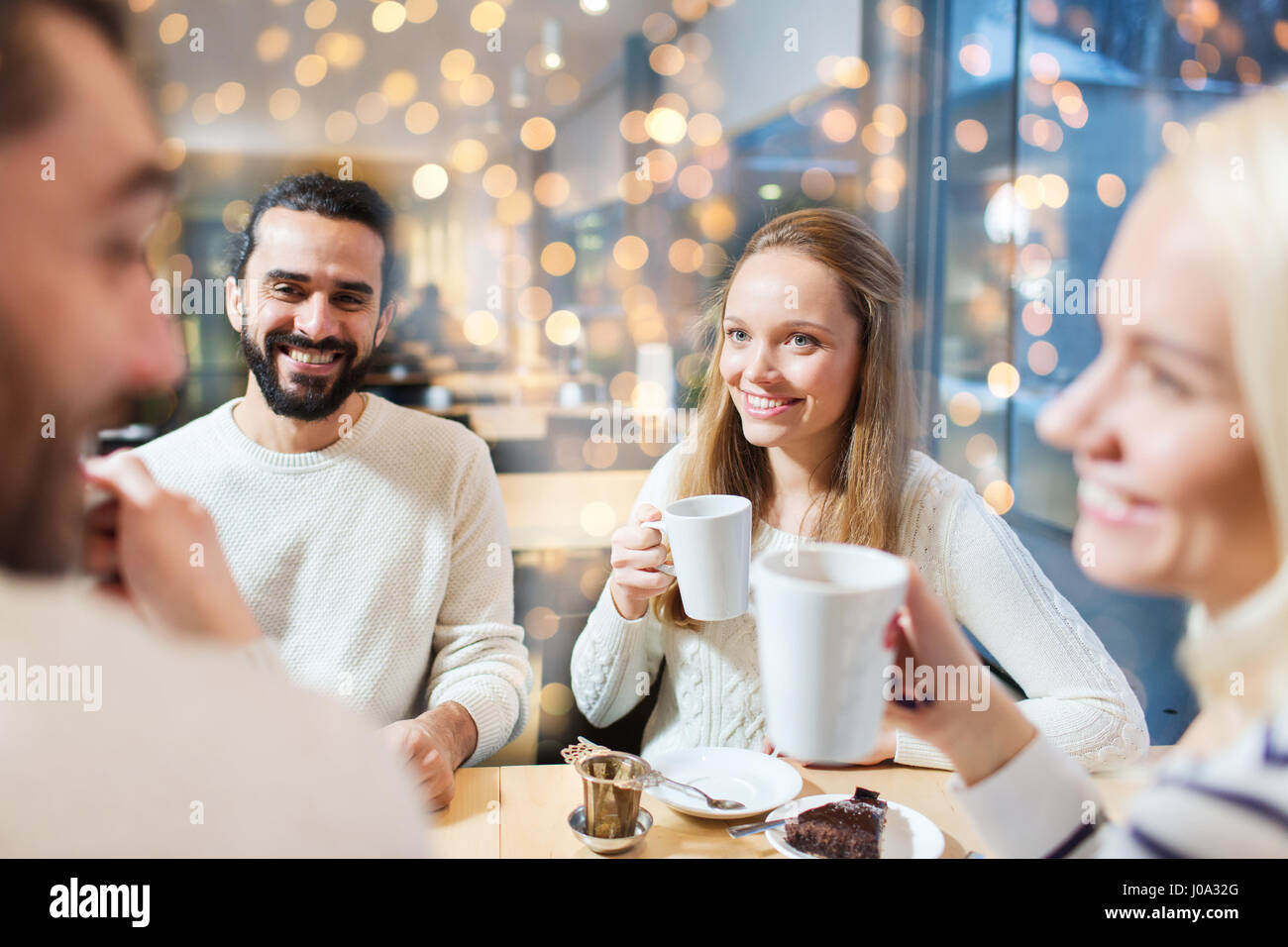 happy friends meeting and drinking tea Stock Photo - Alamy