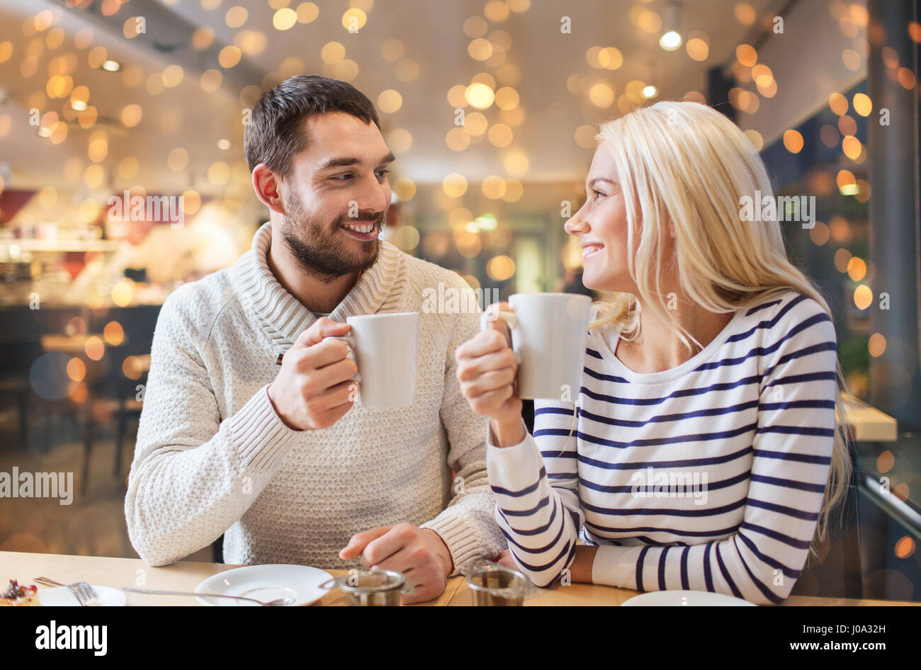 happy couple meeting and drinking tea Stock Photo - Alamy