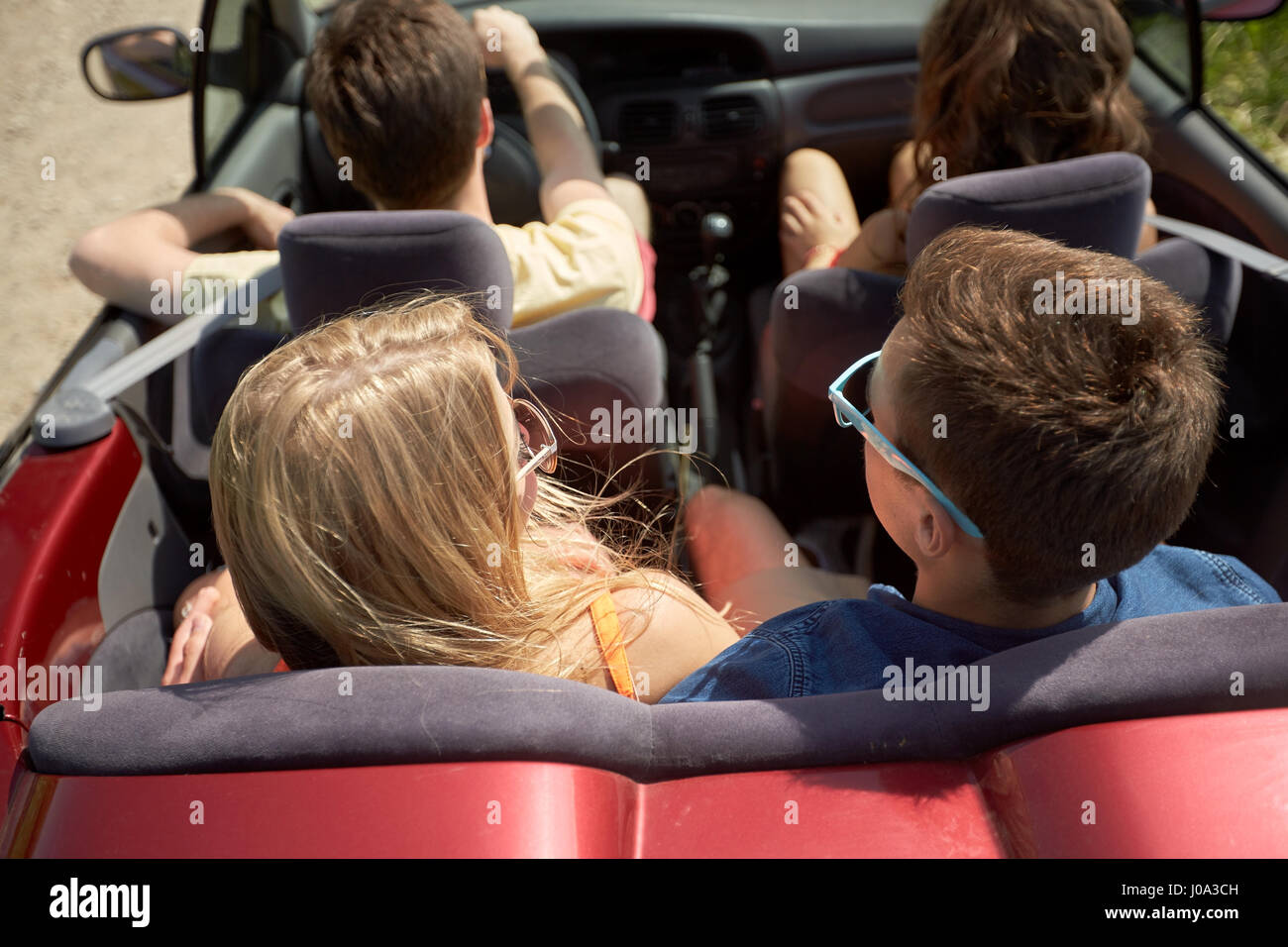 happy friends driving in convertible car at summer Stock Photo - Alamy