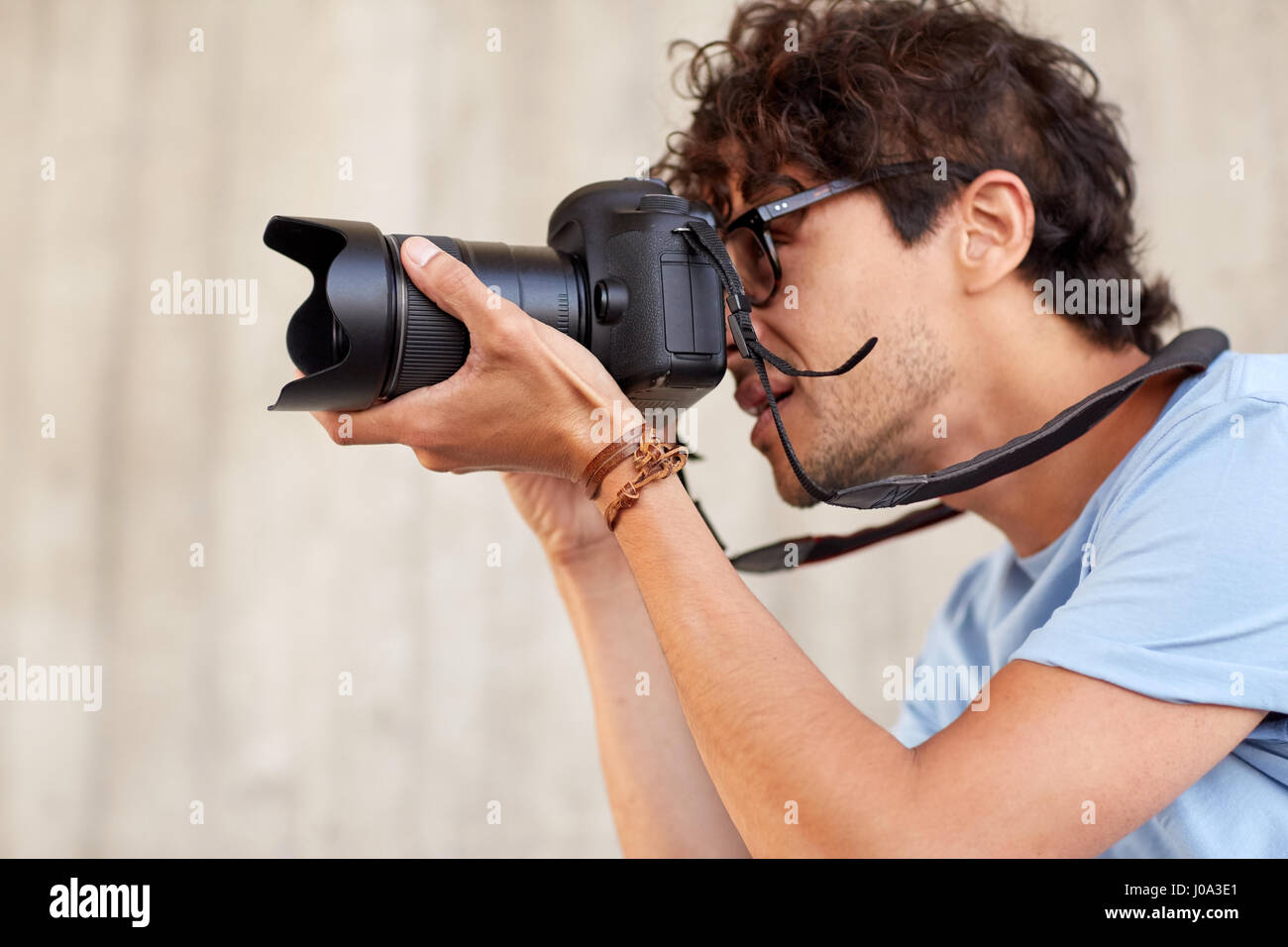 close up of photographer with camera shooting Stock Photo - Alamy