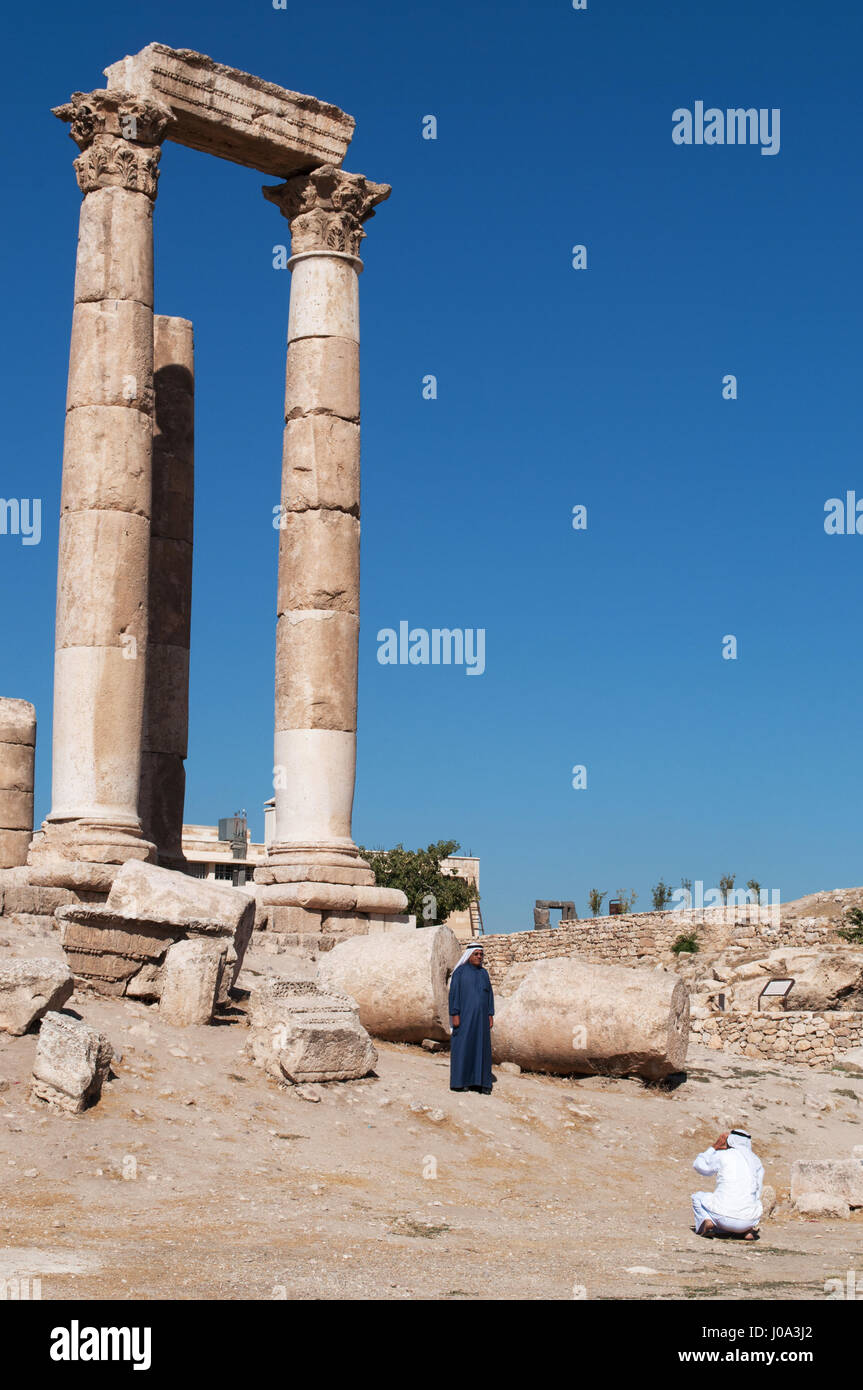 Muslim men in front of the ruins of the Temple of Hercules, the most ...