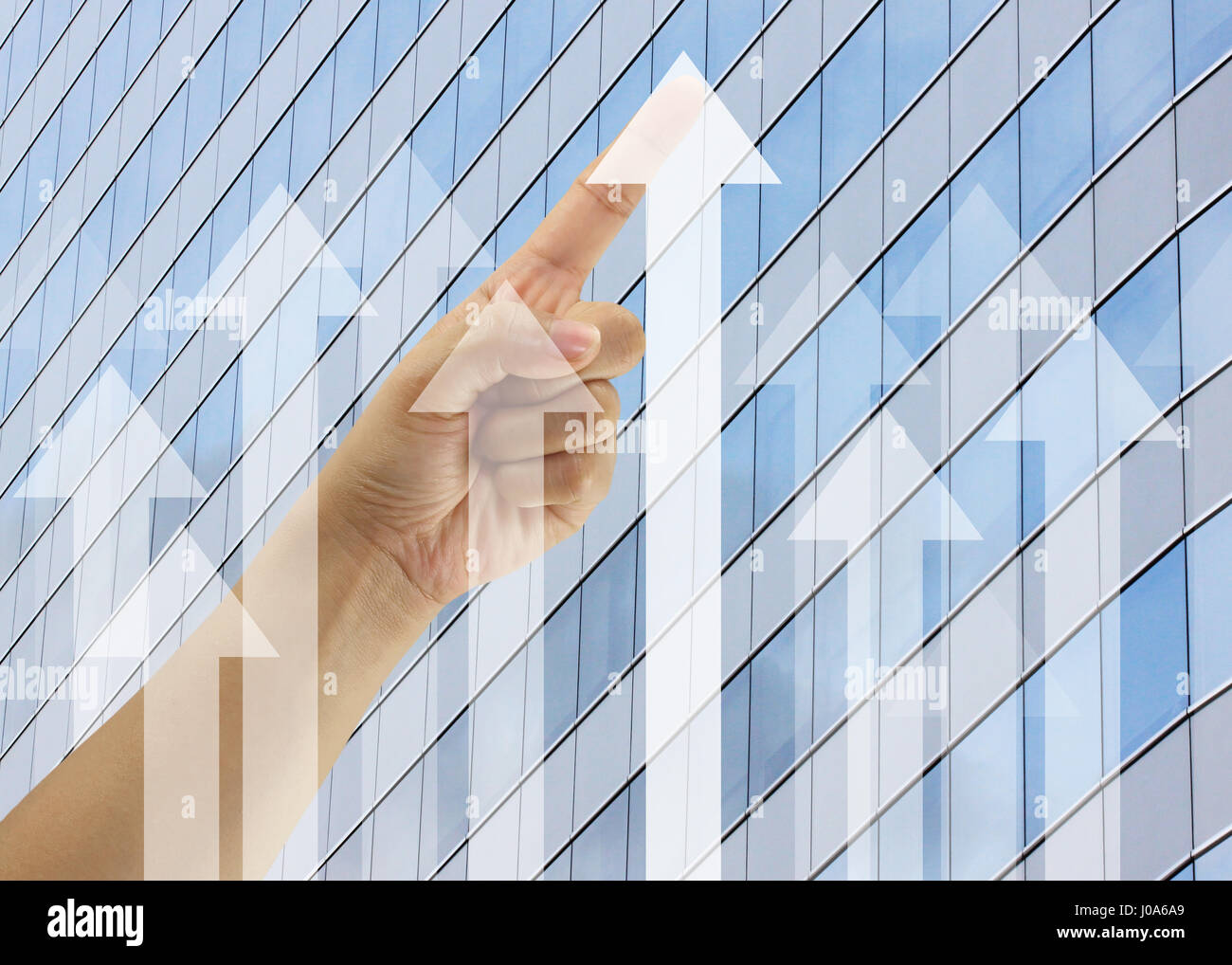 Hand of business man point to the highest point of the arrow in concept ...