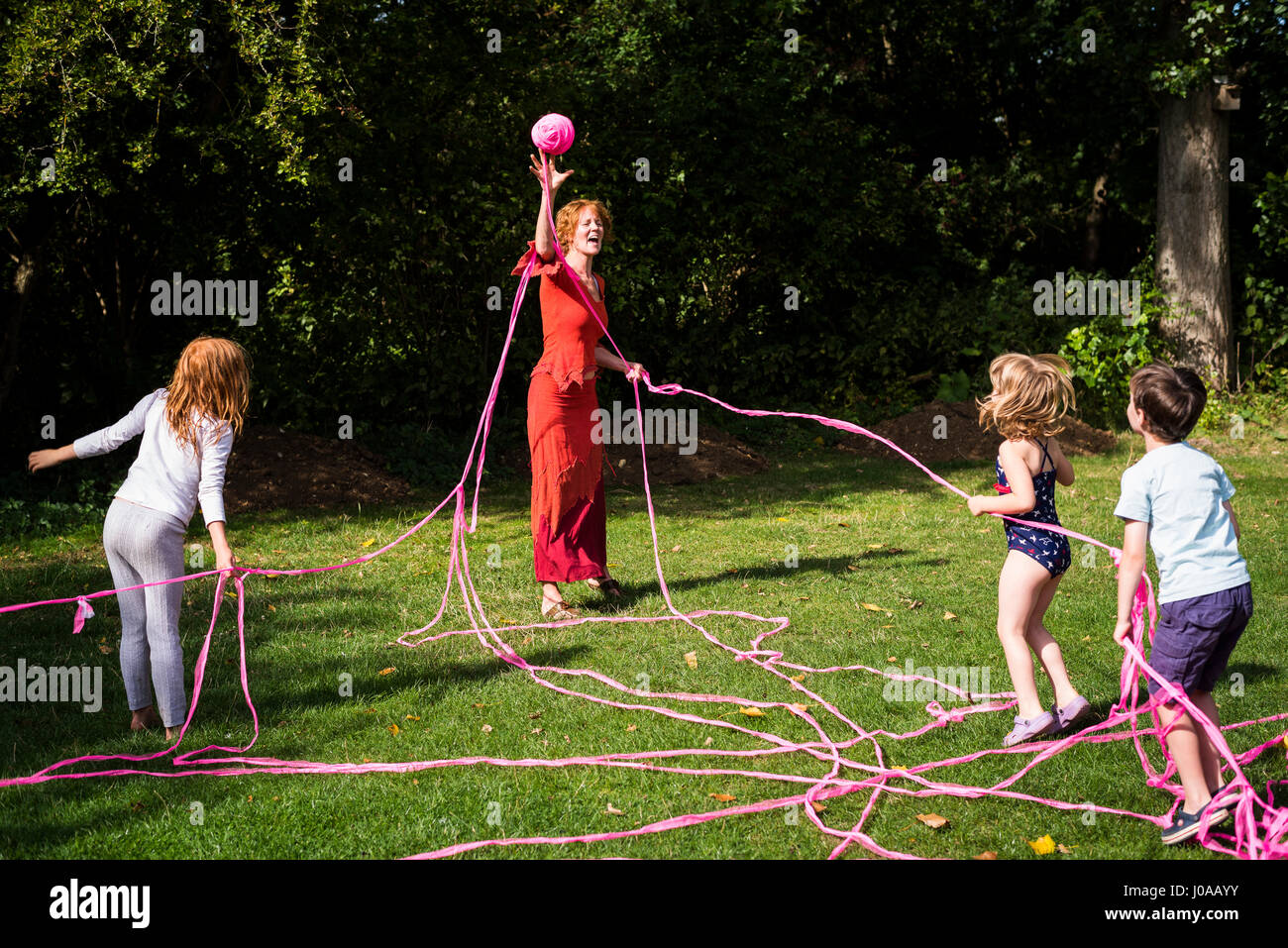 Children throwing ball hi-res stock photography and images - Alamy