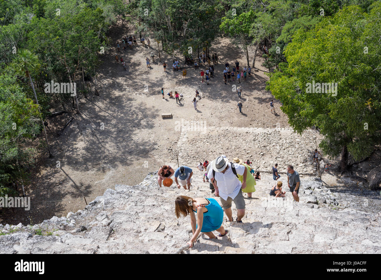 top view of tourists climb the Pyramid Nohoch Mul along the guiding ...