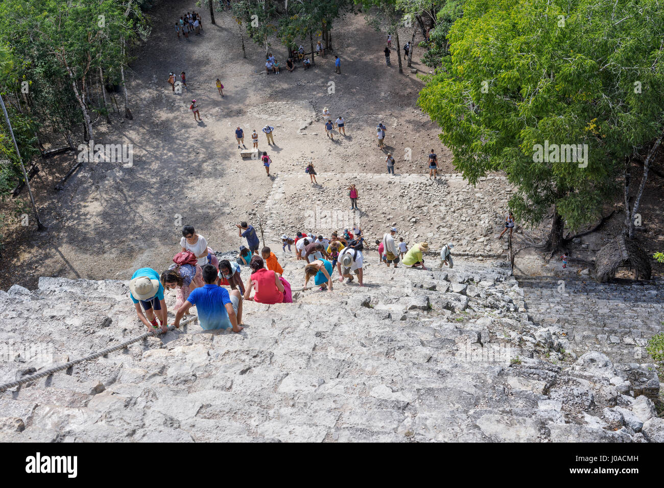 top view of tourists climb the Pyramid Nohoch Mul along the guiding ...