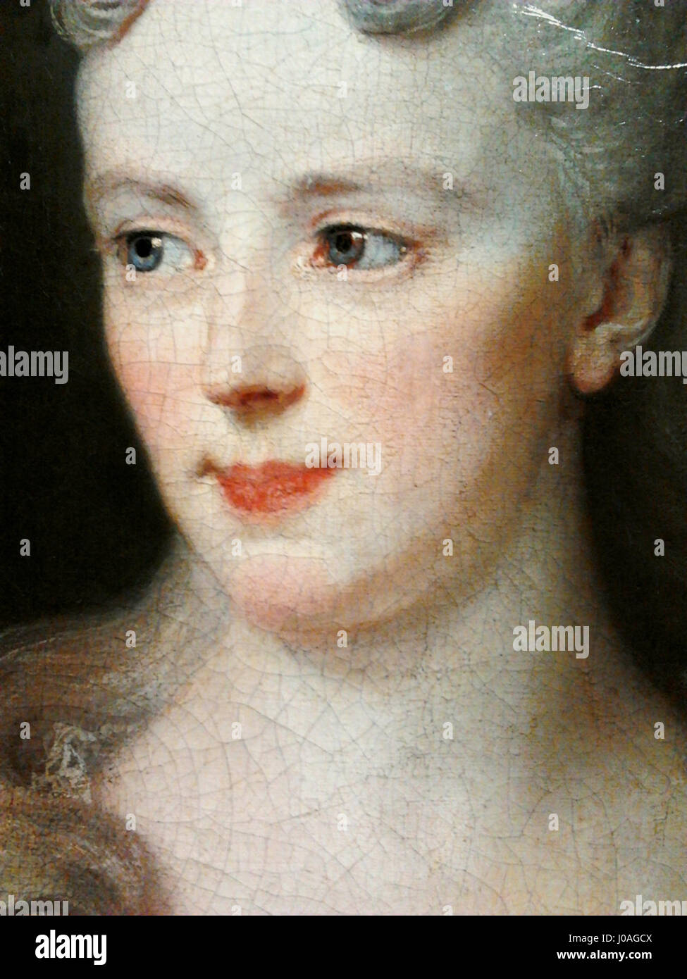 This detail from a portrait by Jean-Marc Nattier shows a lady from the 18th century, displaying ...