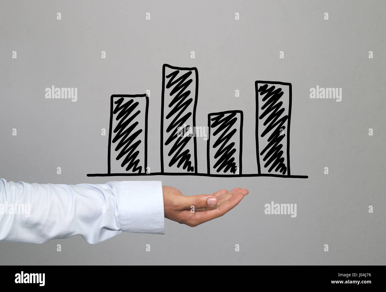 Business bar graph of Hand drawn on a man hand and gray background for ...