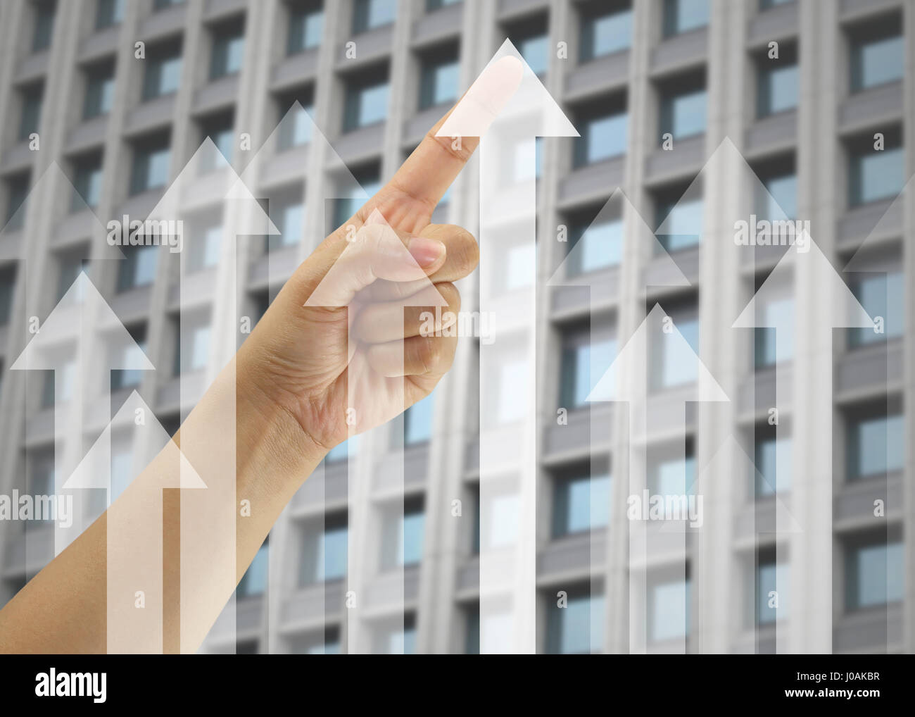 Hand of business man point to the highest point of the arrow in concept ...