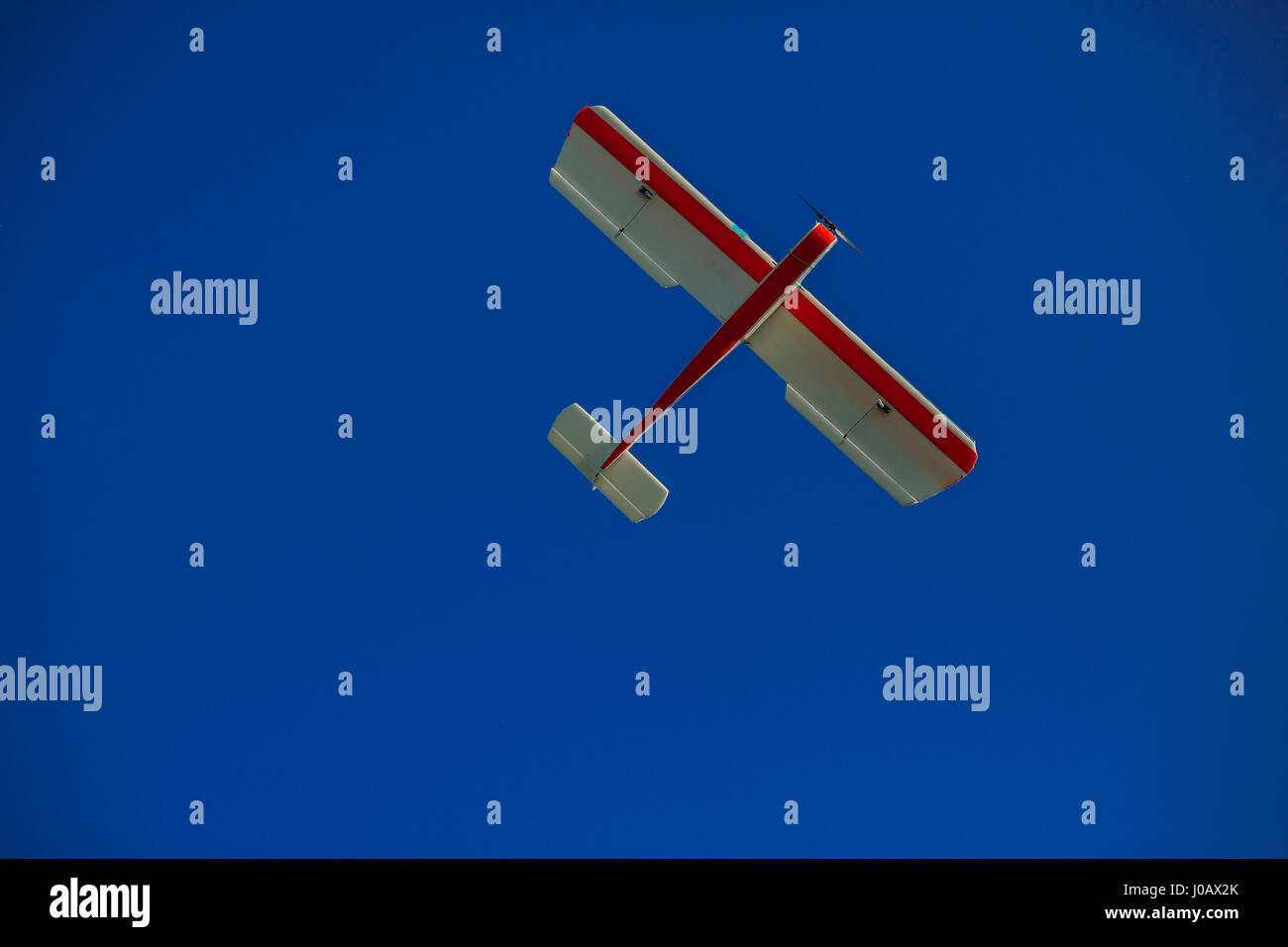 Airplane model flying in a summer sky Stock Photo - Alamy