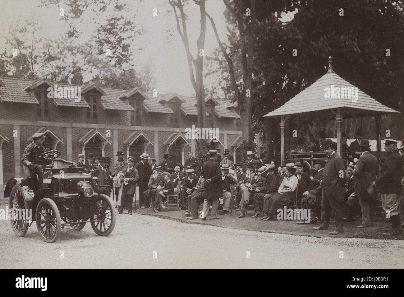 This scene captures a 1901 automobile sale event at Neuilly St James ...