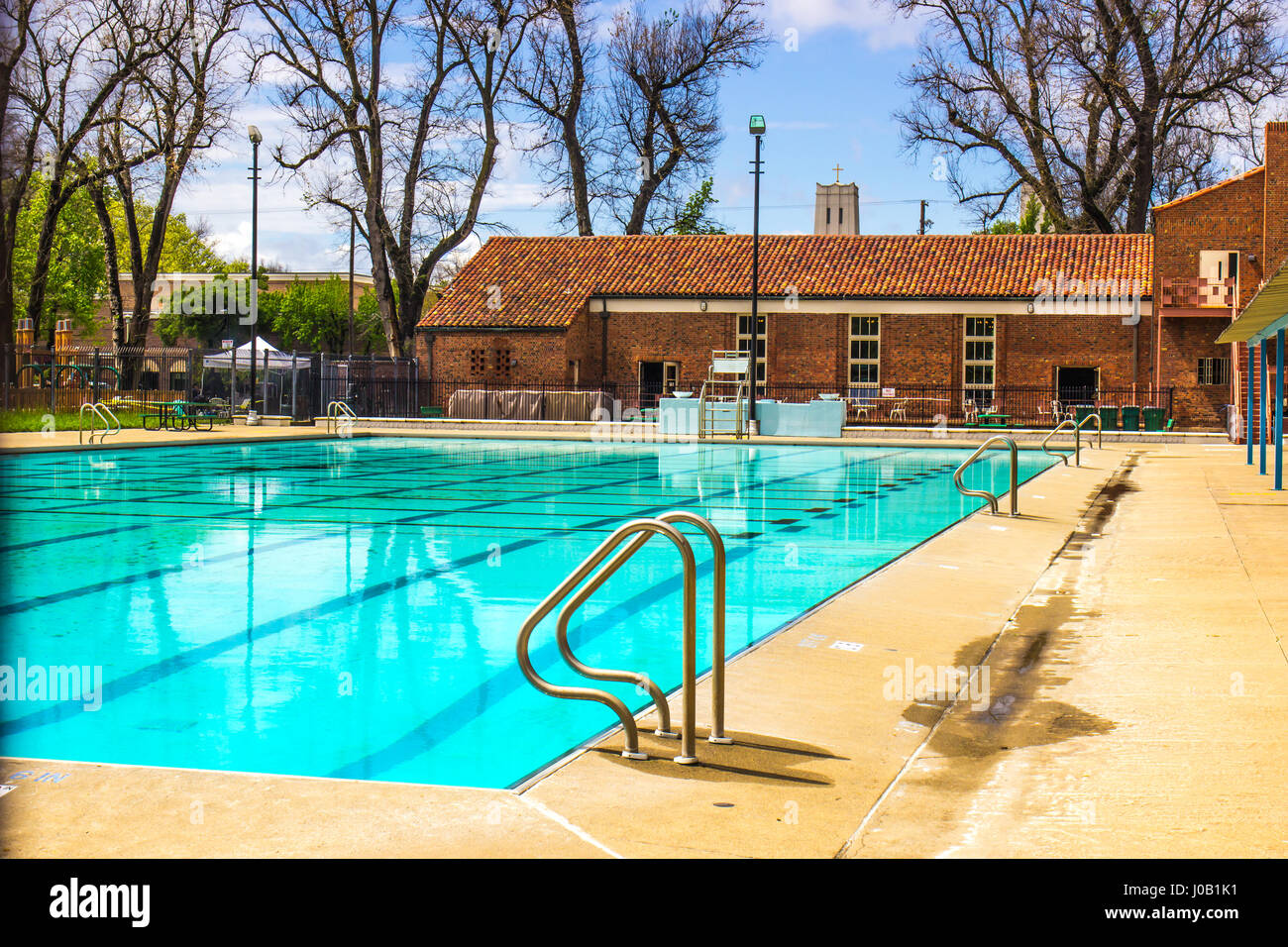 Public Pool With Brick Building In Background Stock Photo - Alamy