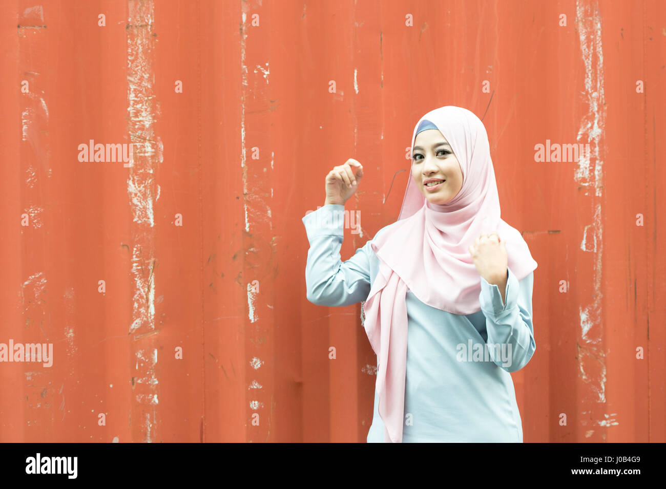 Closeup portrait of young confident Muslim female with the background ...