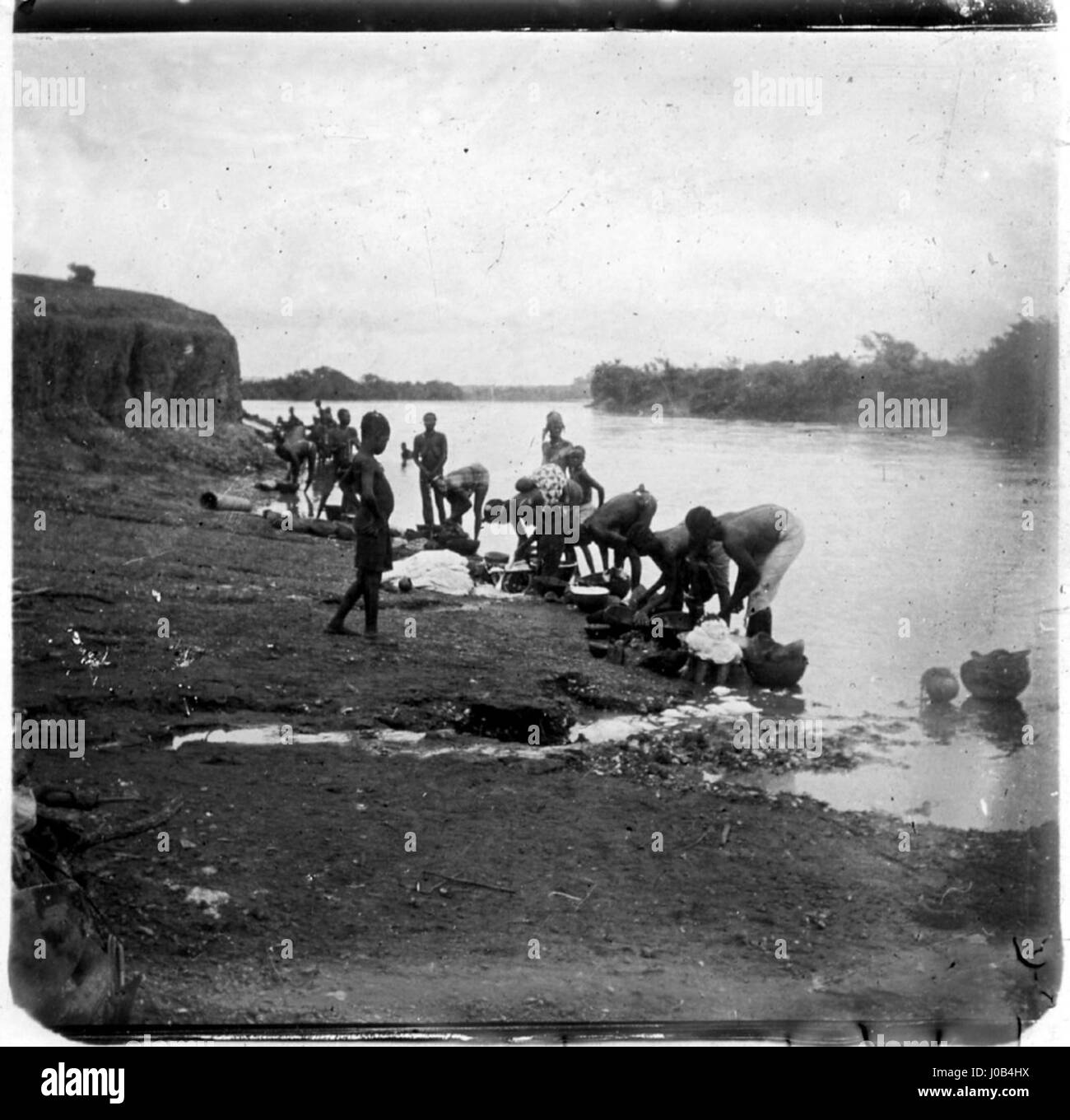 This scene from 1899, showing women washing clothes by the Milo River ...