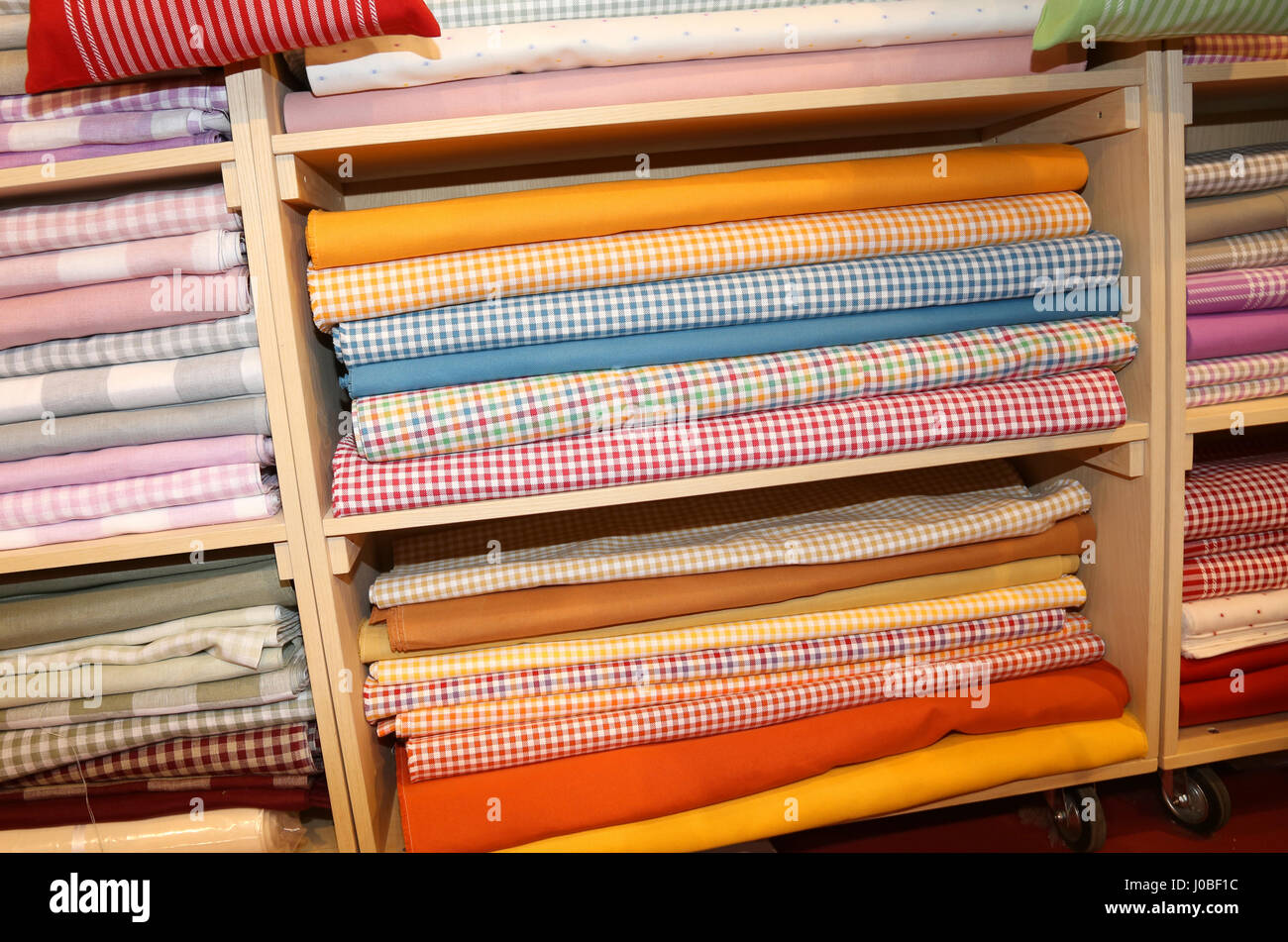 Inside the fabric store with many textile products for sale on the ...