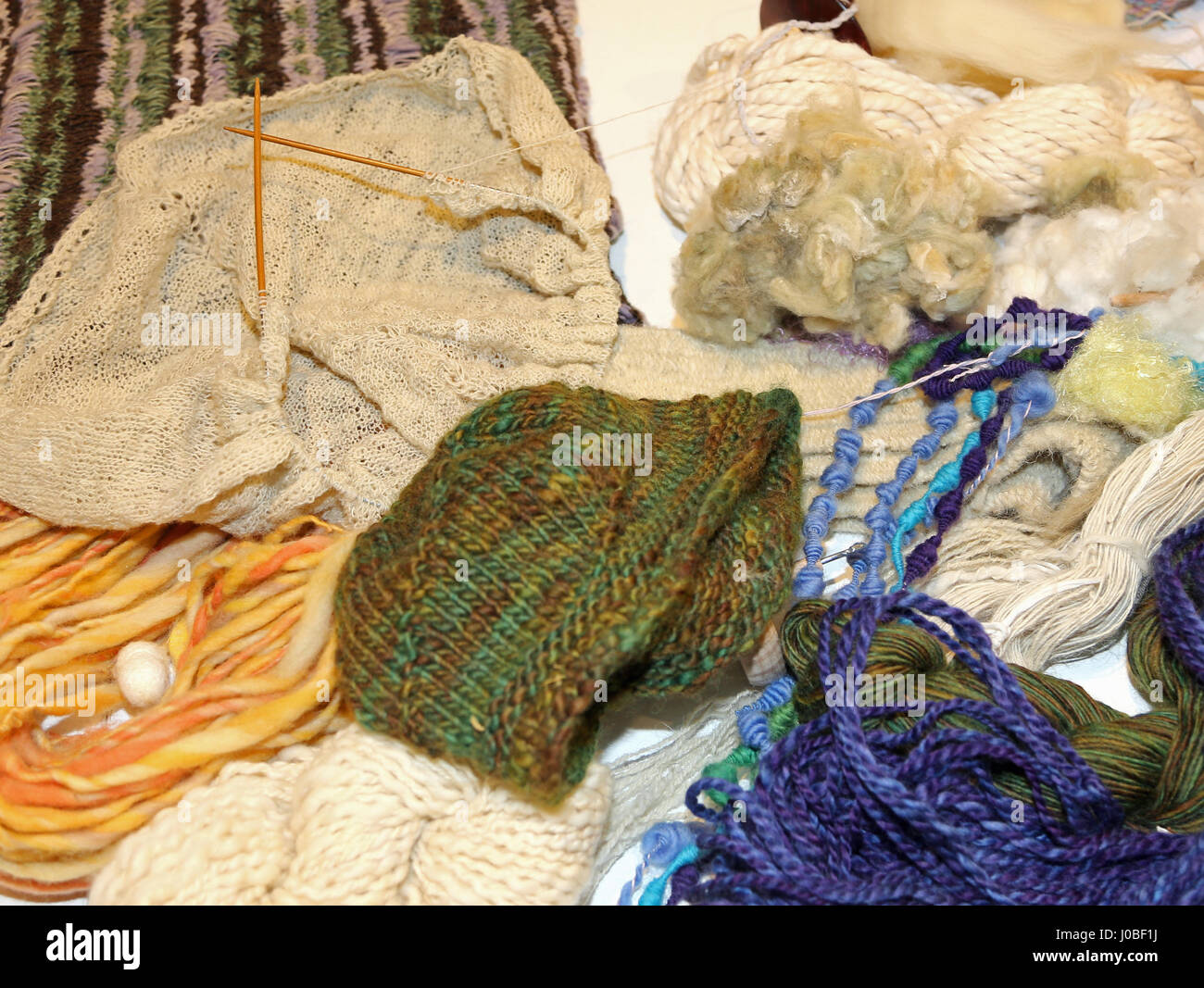many handmade crafts from expert seamstress with knitting needles and ...