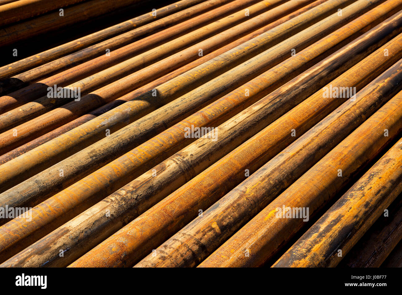 Rust stell pipe for drilling in geology and mining Stock Photo - Alamy