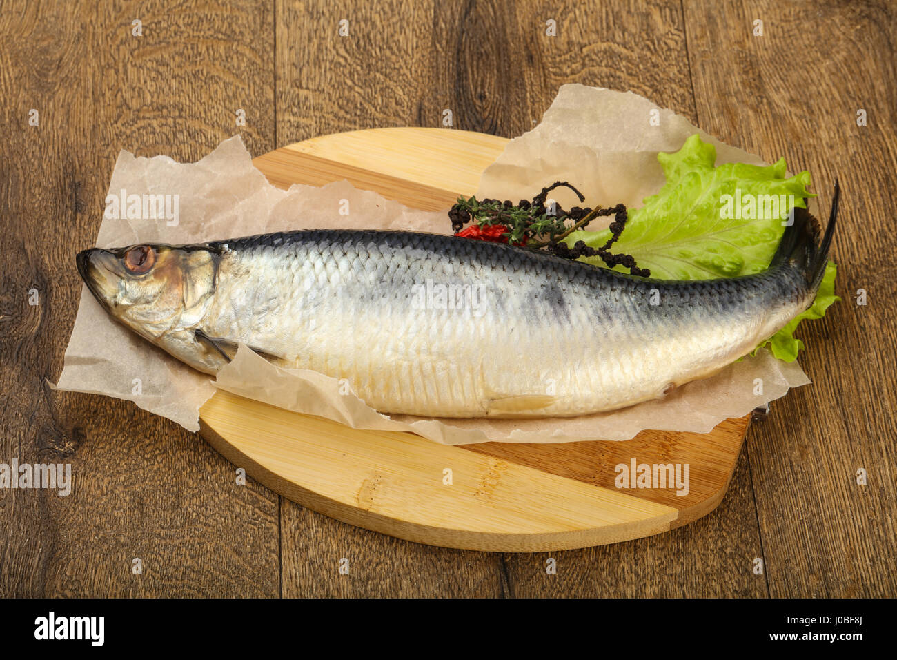 Salted Herring fish with pepper and spices Stock Photo - Alamy